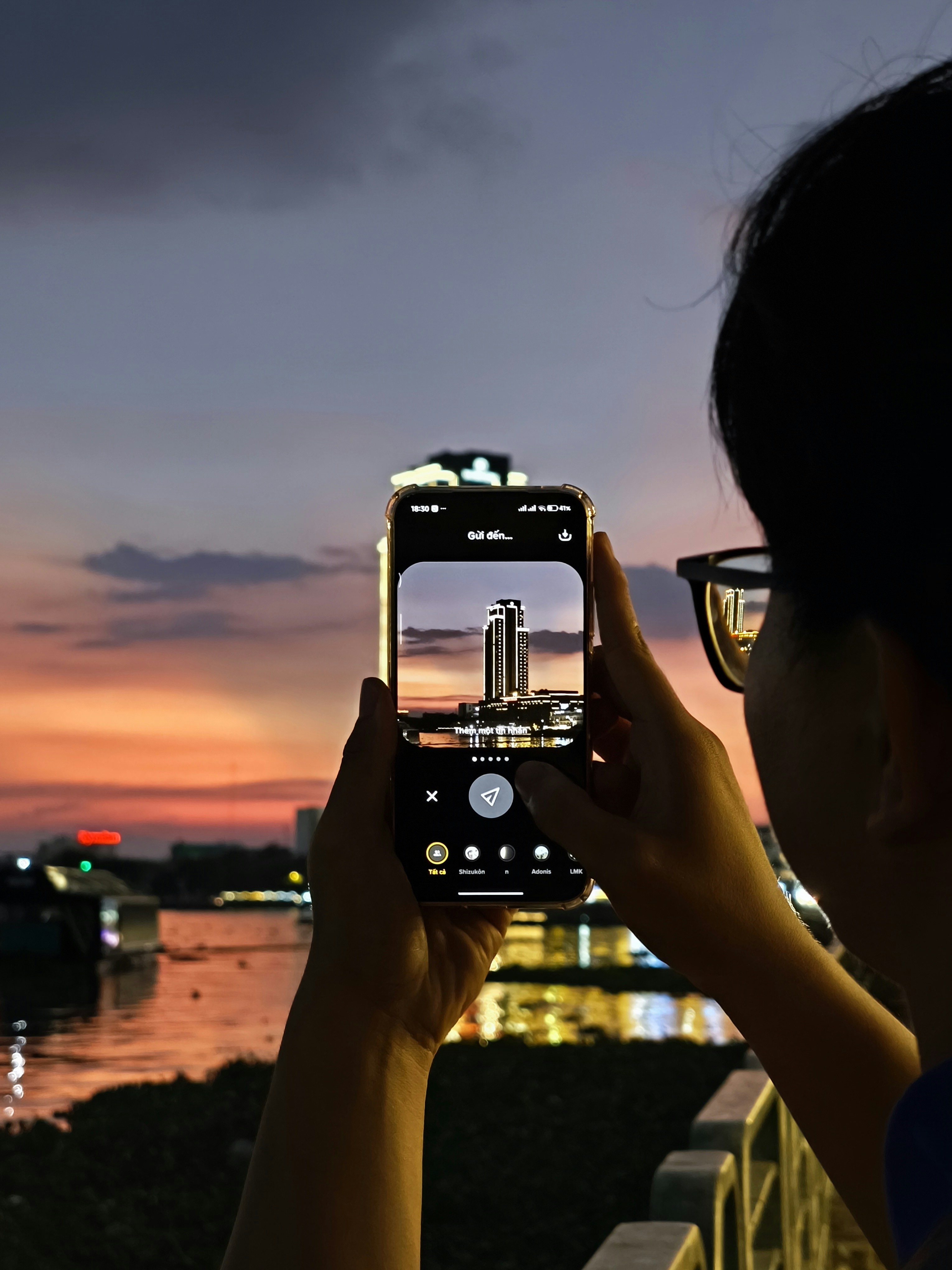 Sunset Portrait: Framing the City through a Phone Glass