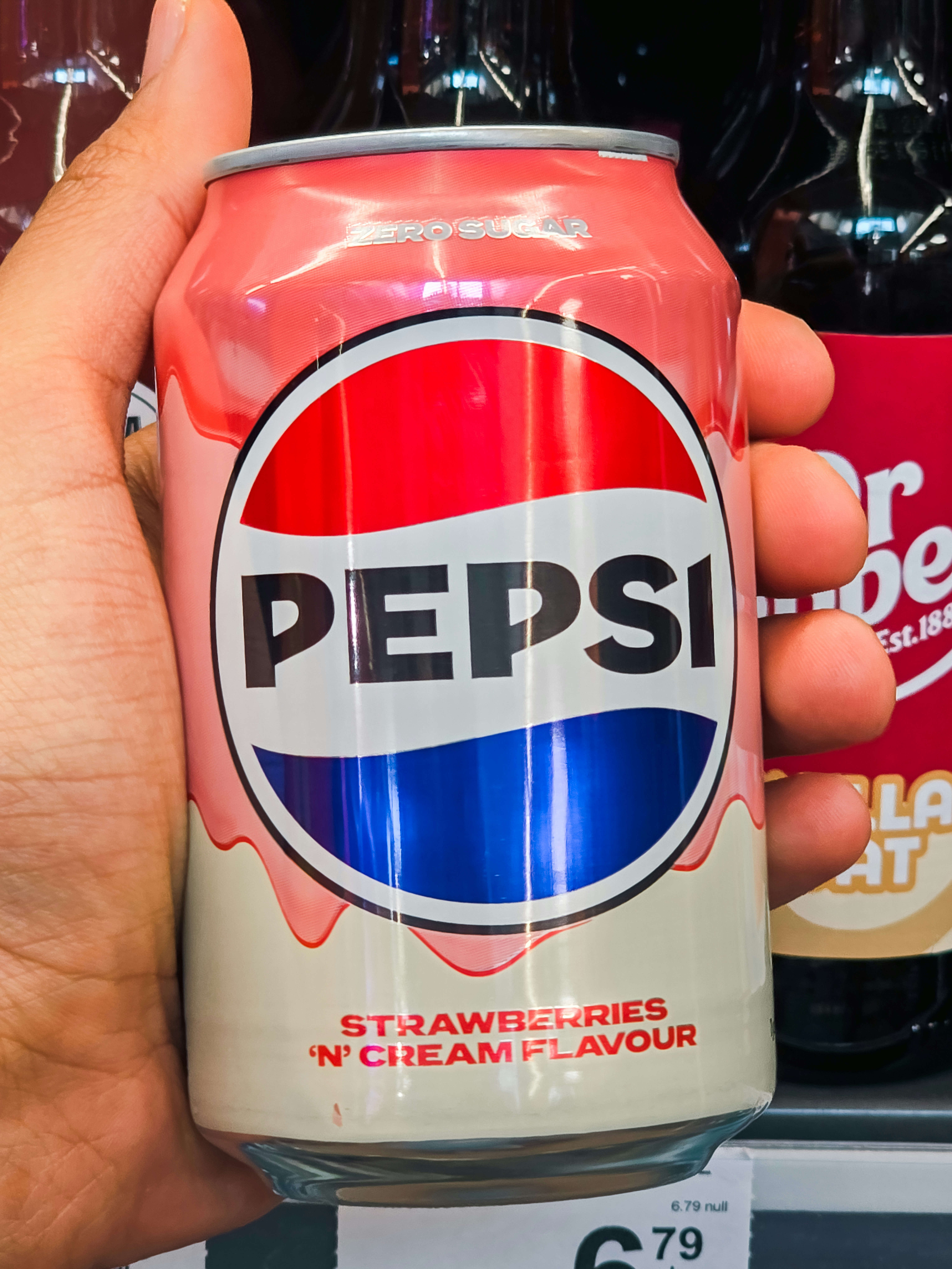 Strawberry Cream Pepsi Can Gripped in Hand