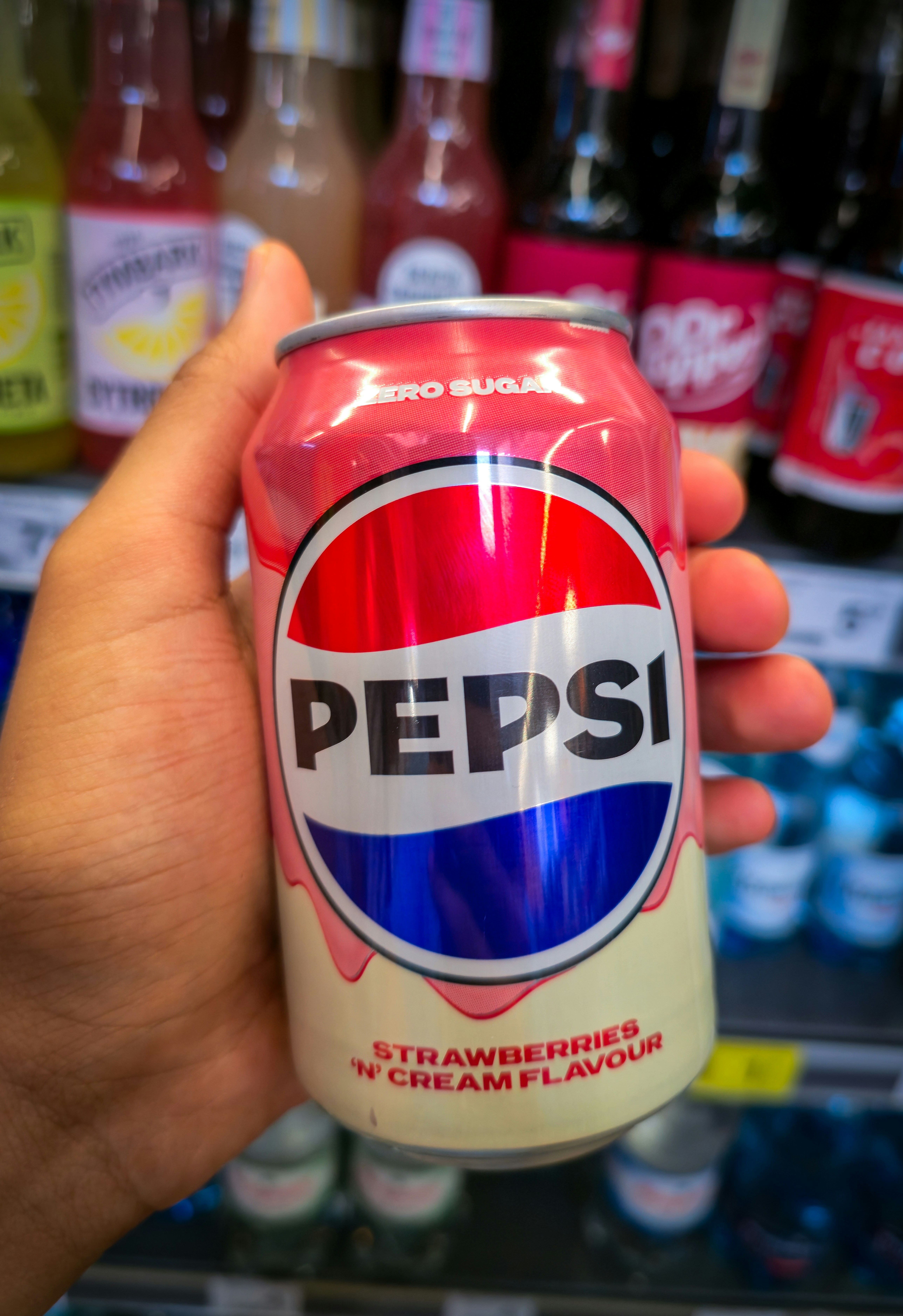 Pepsi Can in Hand at Aisle Edge