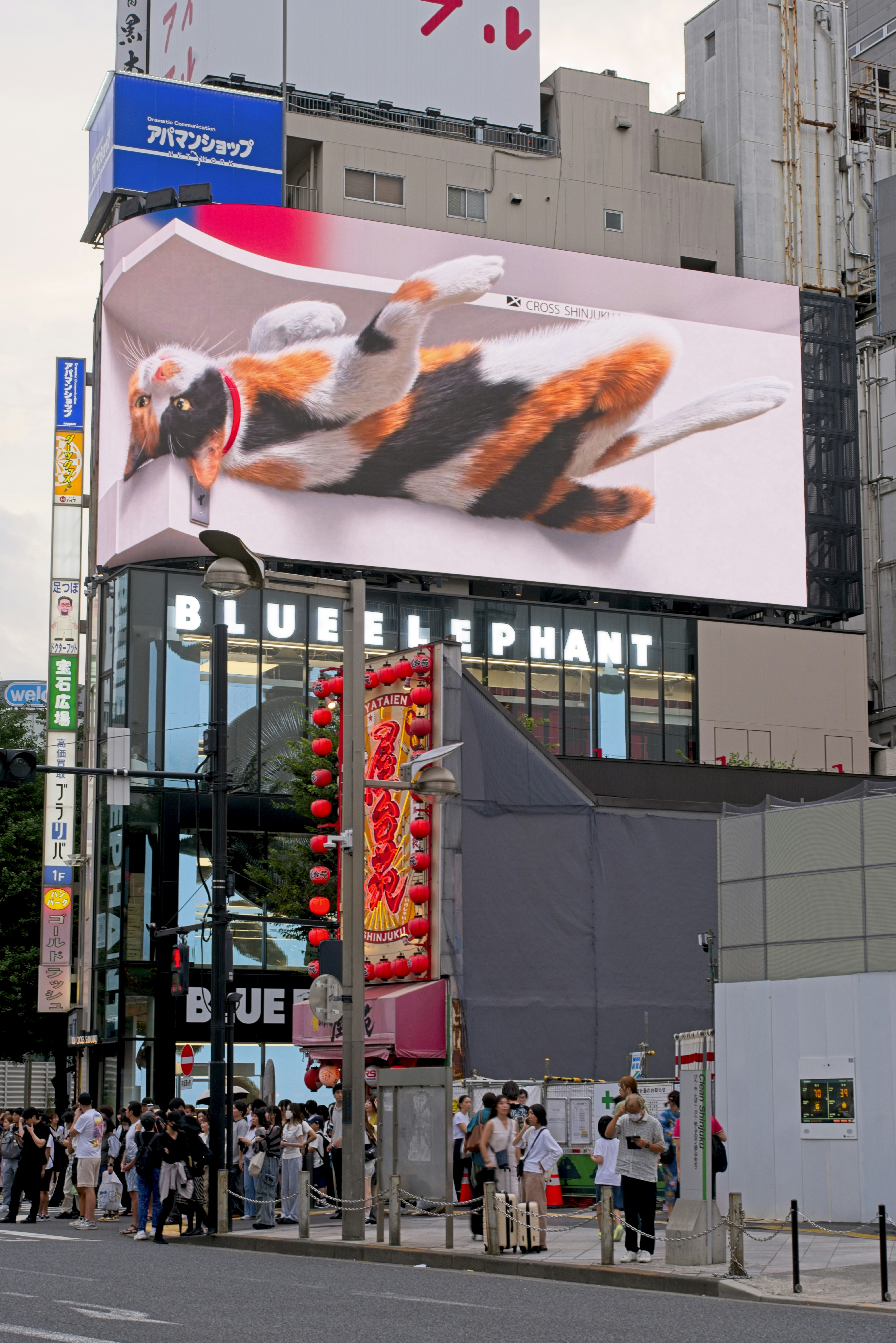 Billboard Tiger Over Tokyo: A Busy Street Portrait