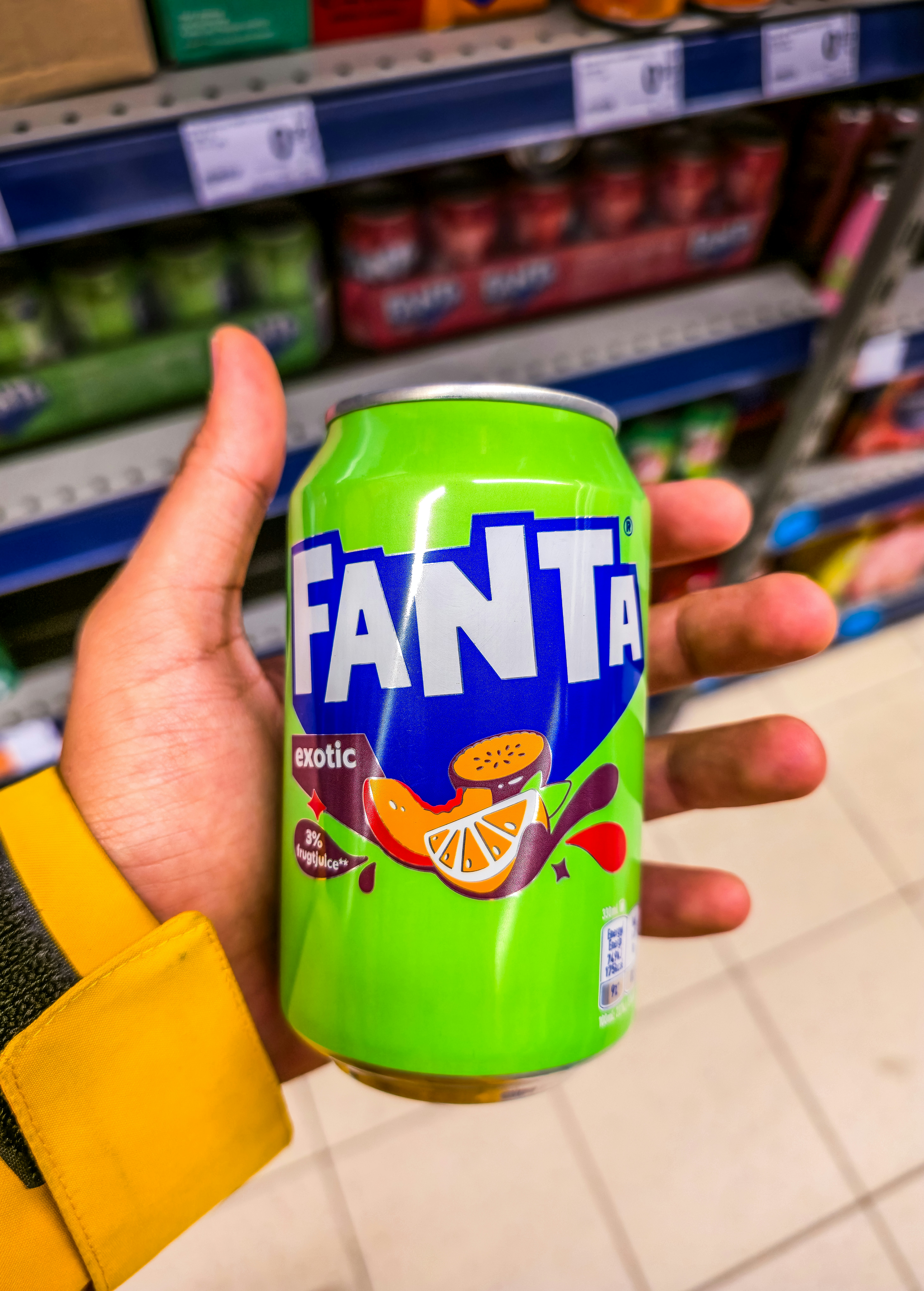 Green Fanta Can in Hand: A Flavor of Grocery Aisle Color