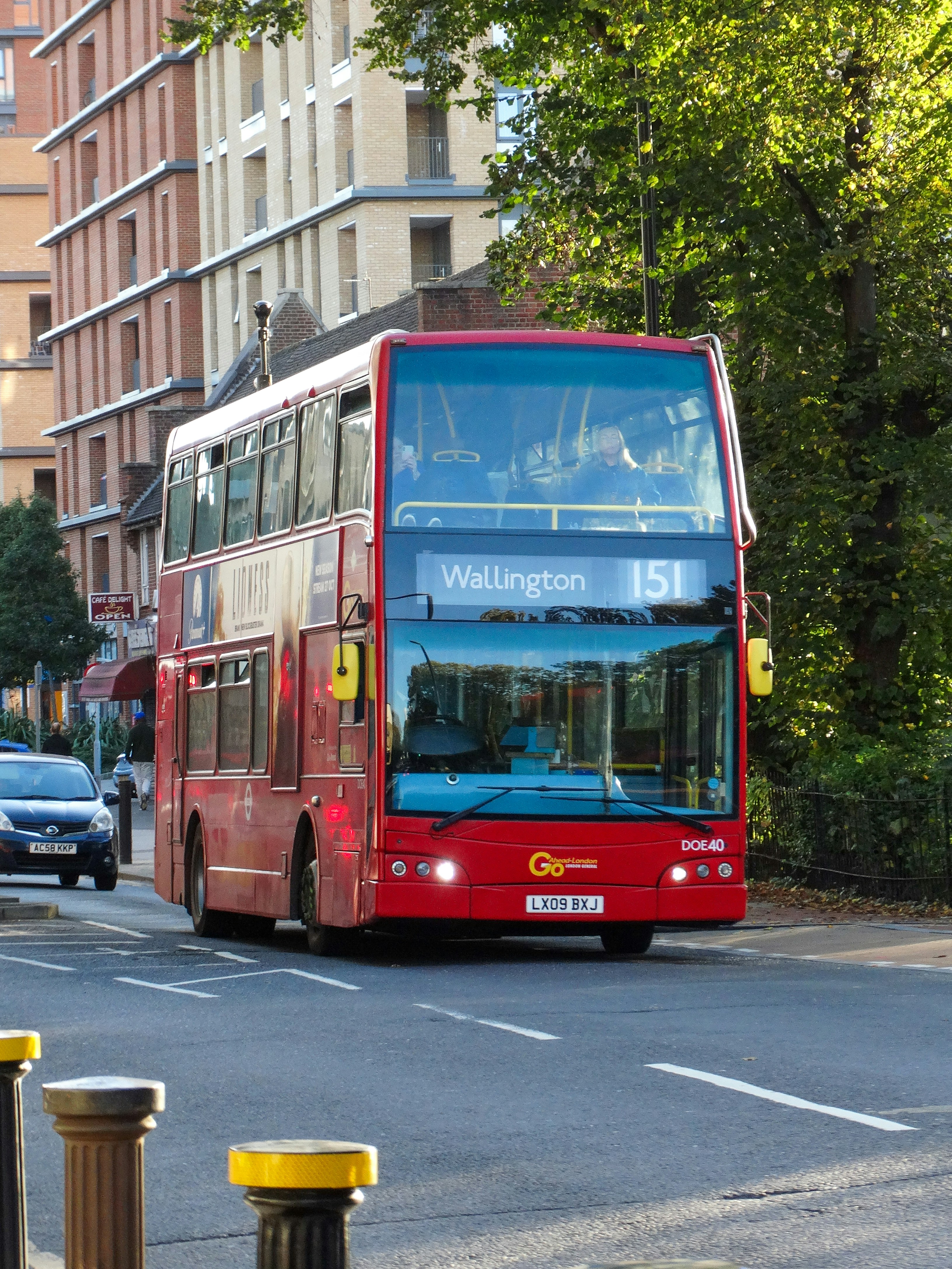 Red London Double-Decker on a Busy Street