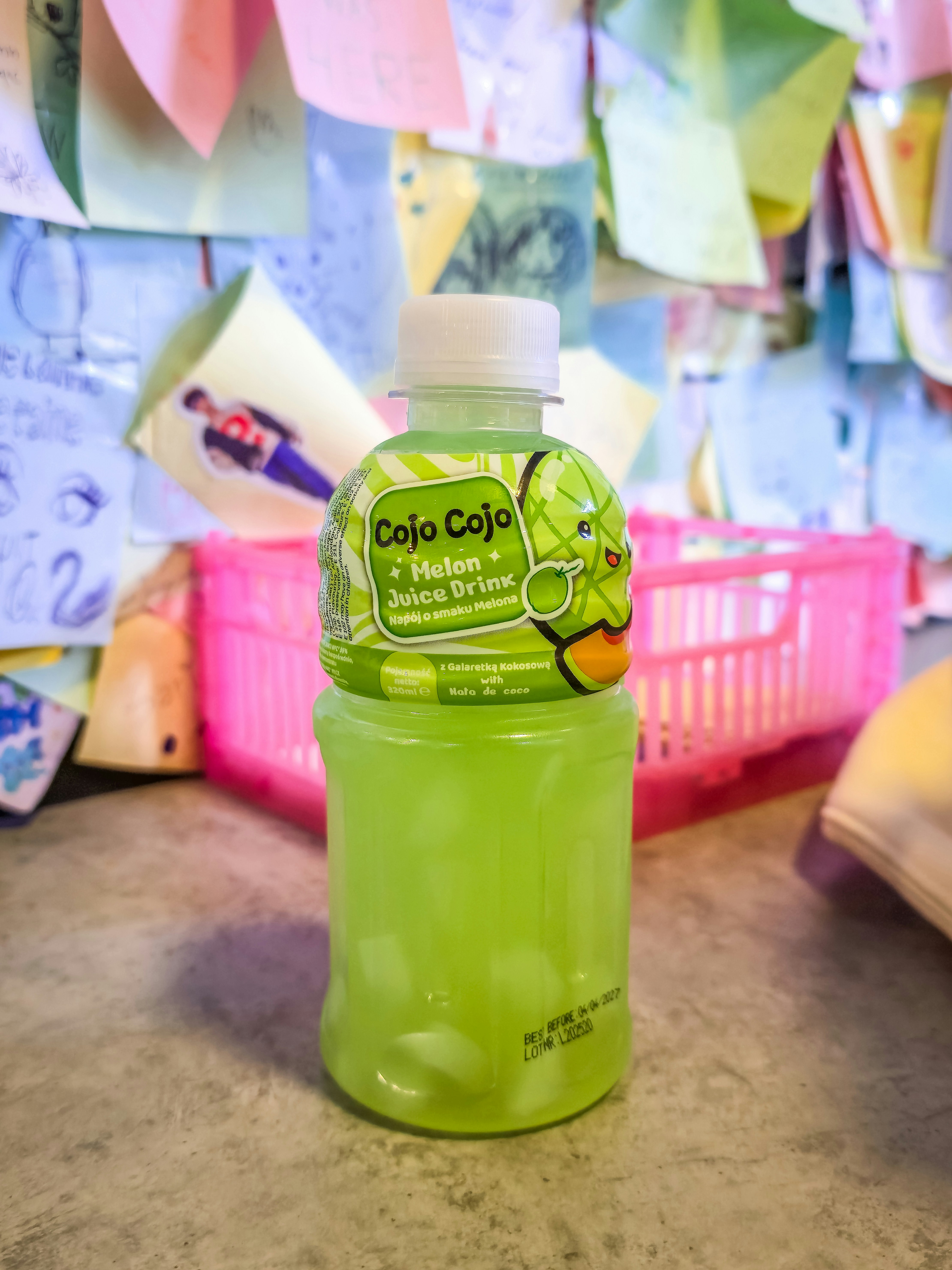 Bright Green Citrus Bottle Anchors a Colorful Backdrop of Notes