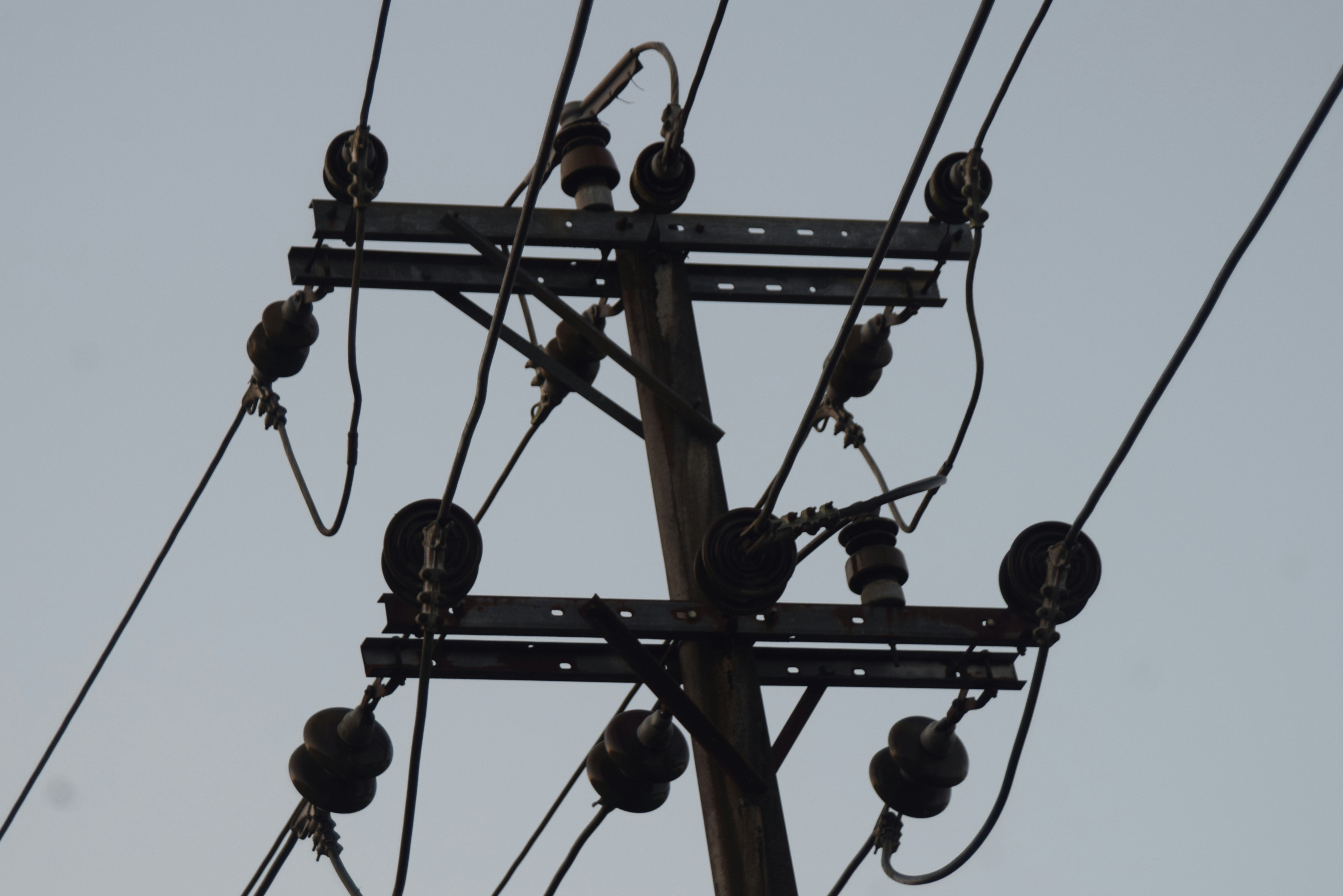 Tangled Lines: A Closer Look at a Crucial Utility Mast