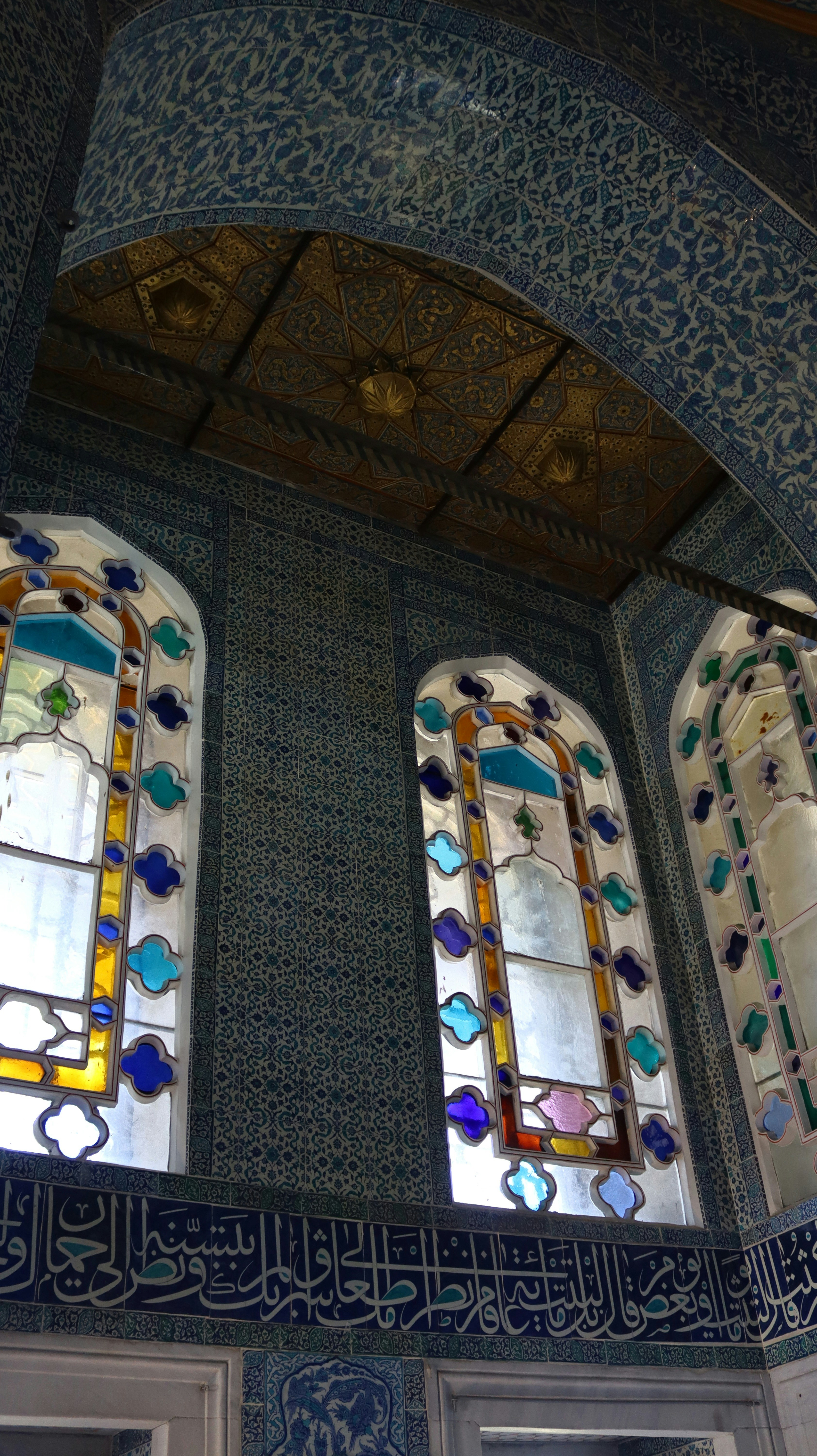 Stained Glass Echoes: Light and Tile in Blue Murals