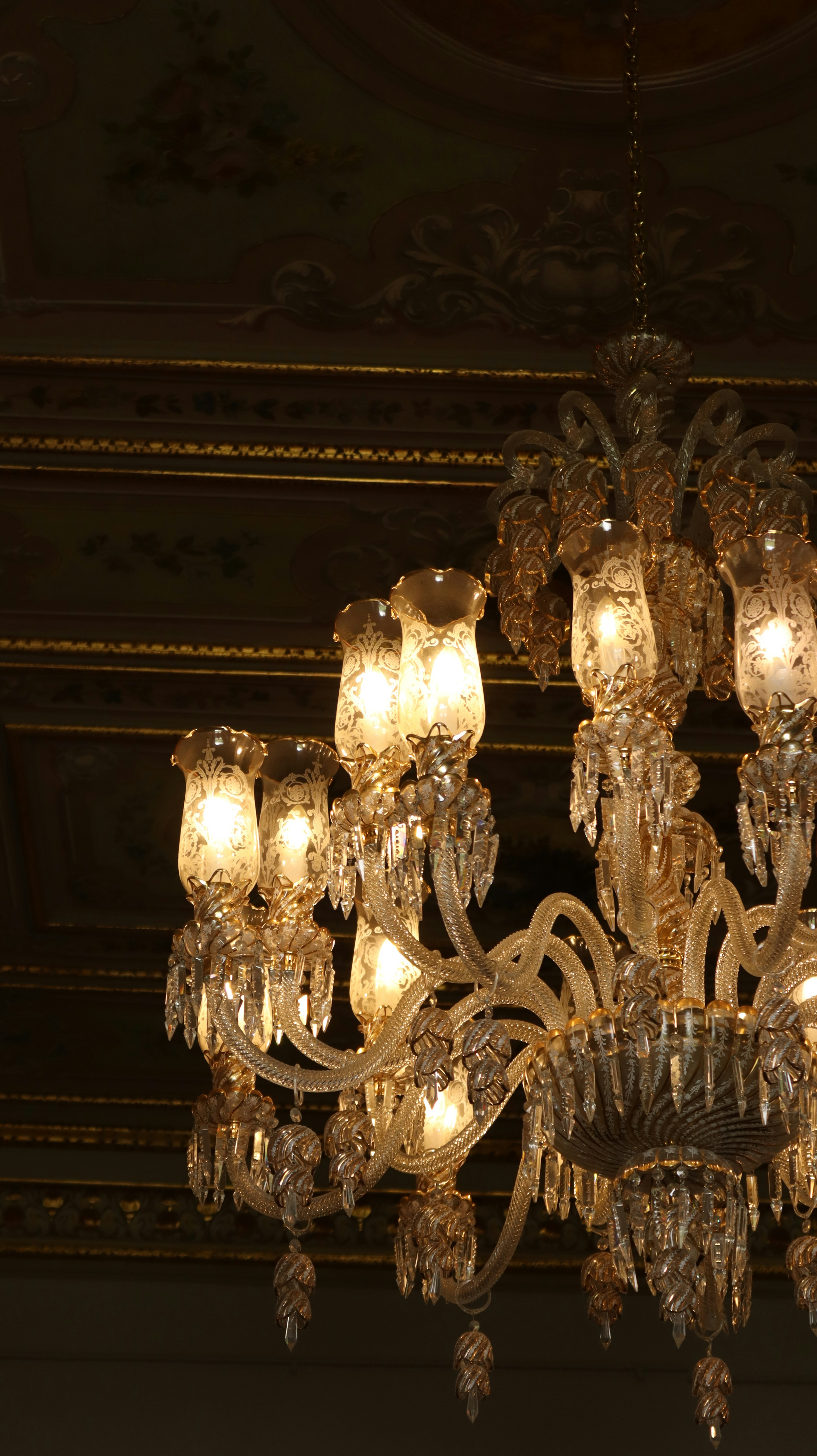 Crystal Constellation: An Opulent chandelier lighting a vaulted ceiling