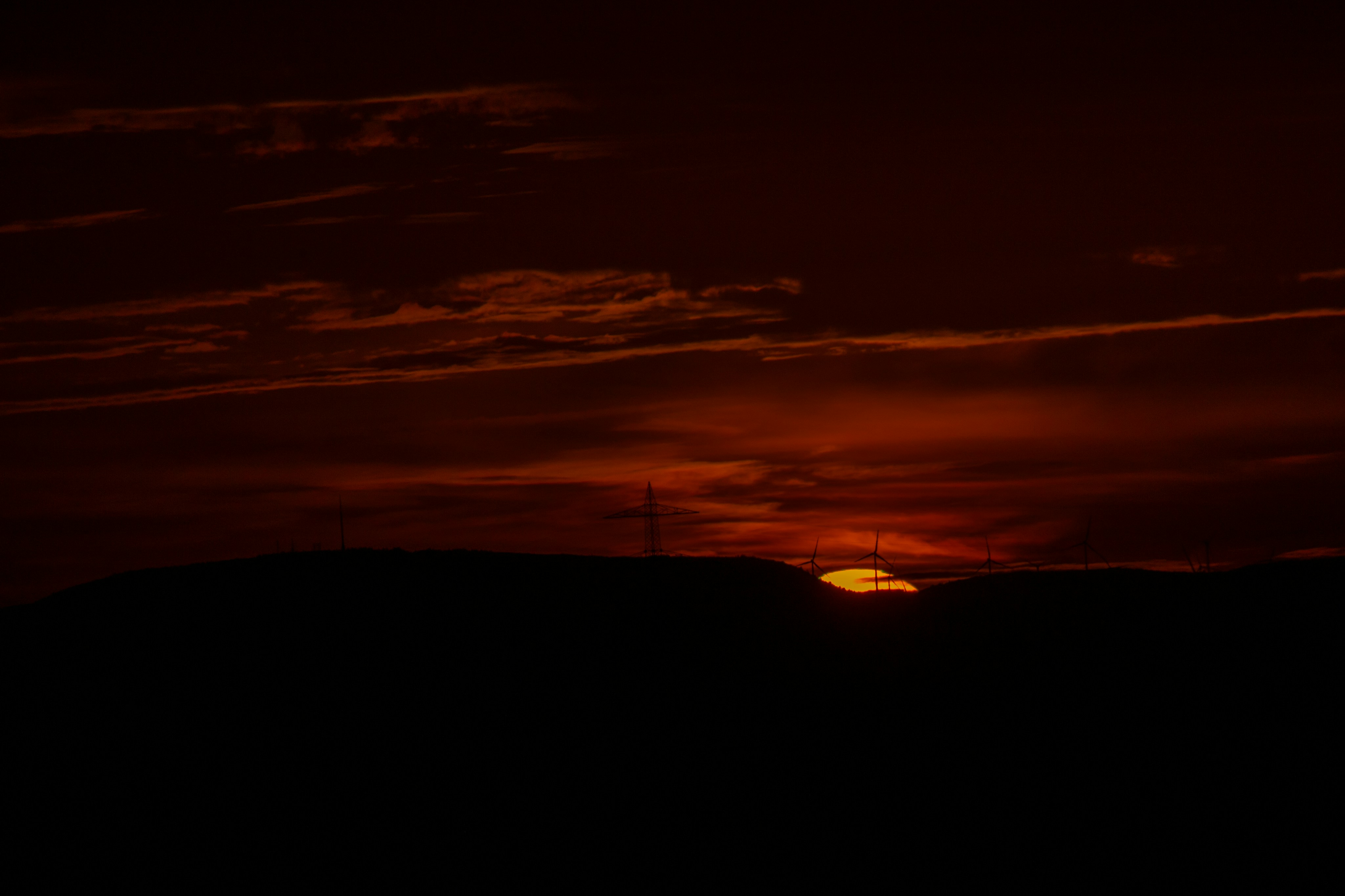Horizon Fire: Silent Sunset Over the Distant Ridge