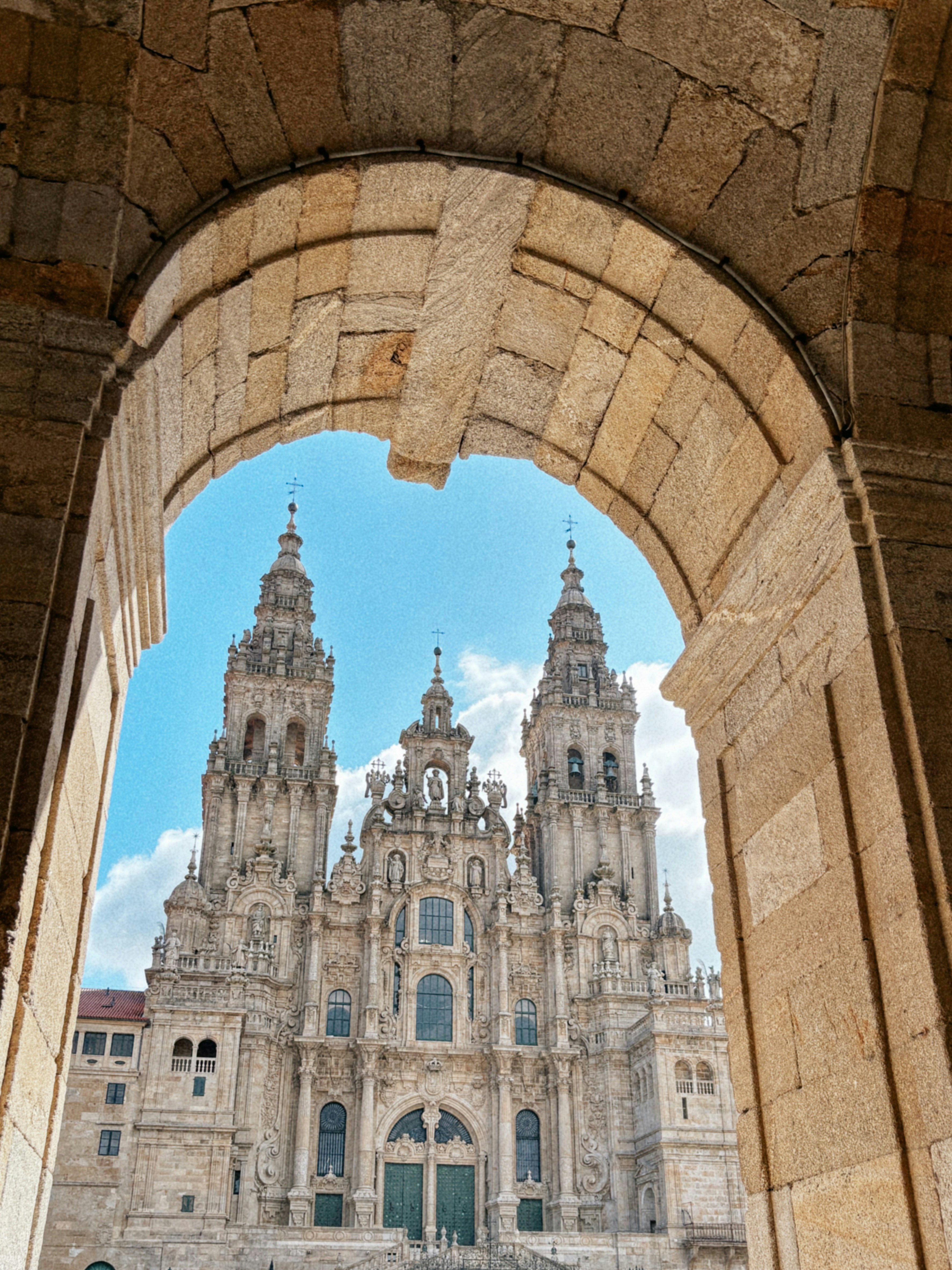 Architectural Archway Framing a Cathedral's Facade