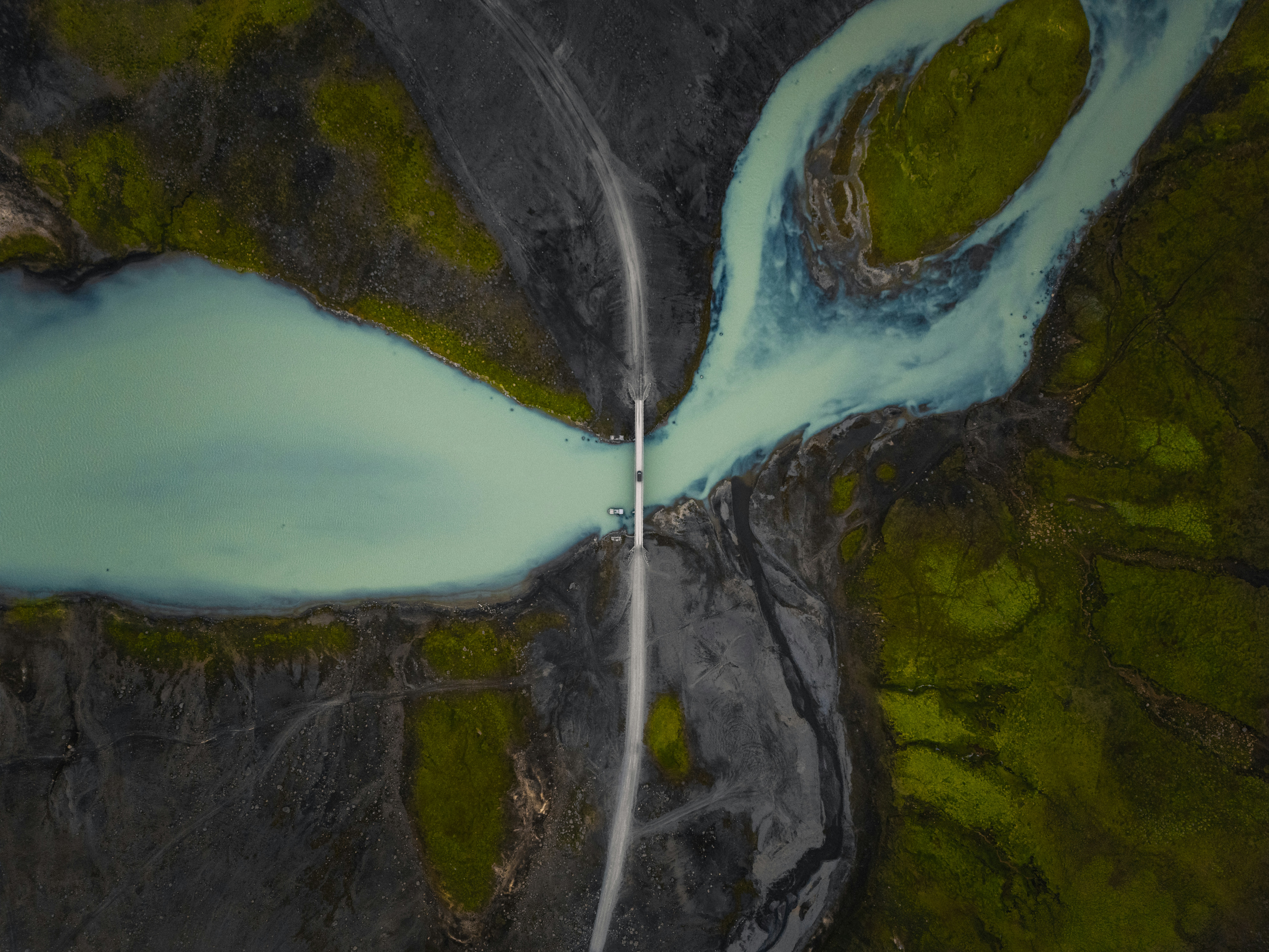 Ice-blue Delta: Aerial Confluence of River and Gorge