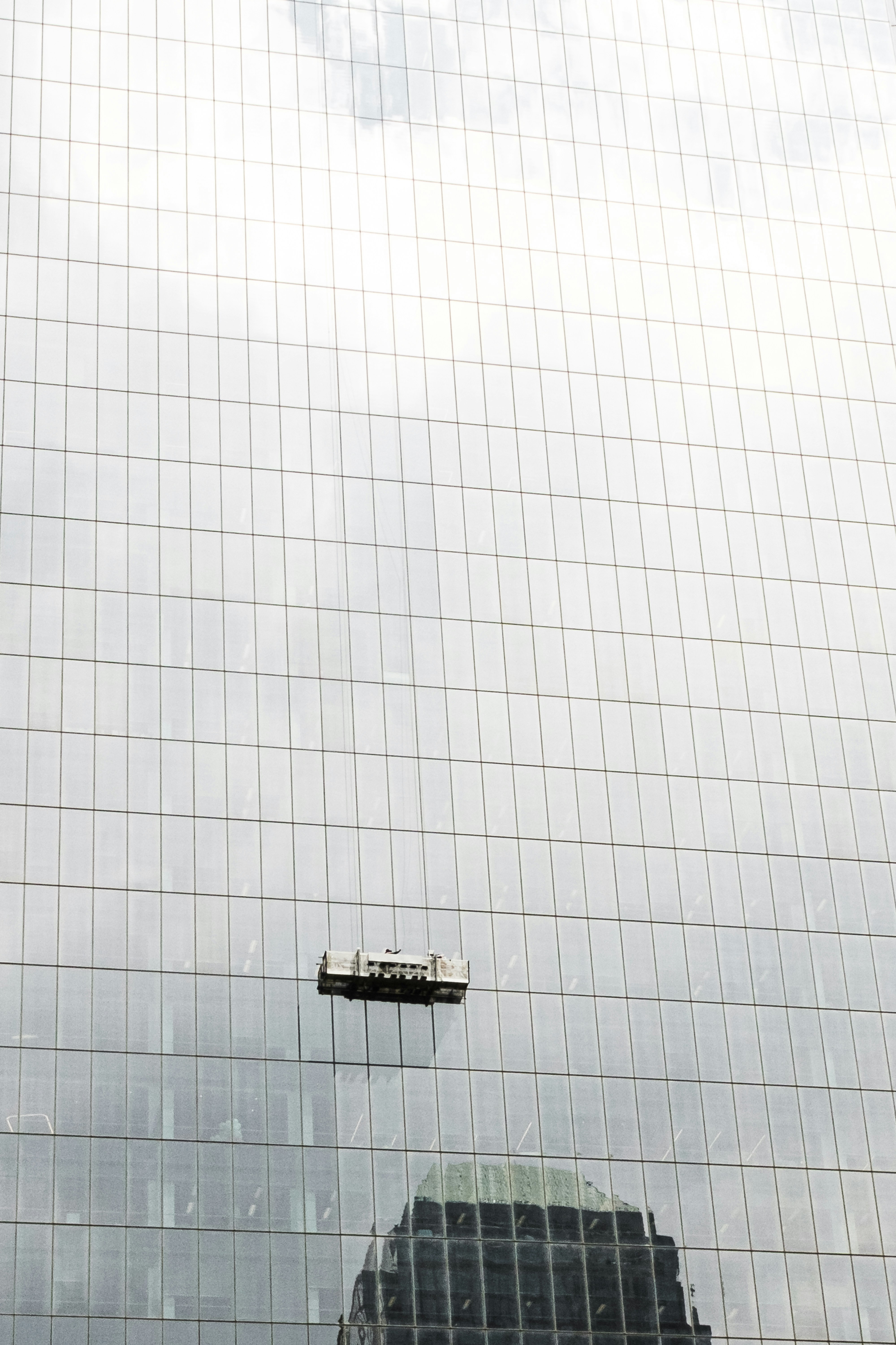 Floating Platform on a Glassy City Facade