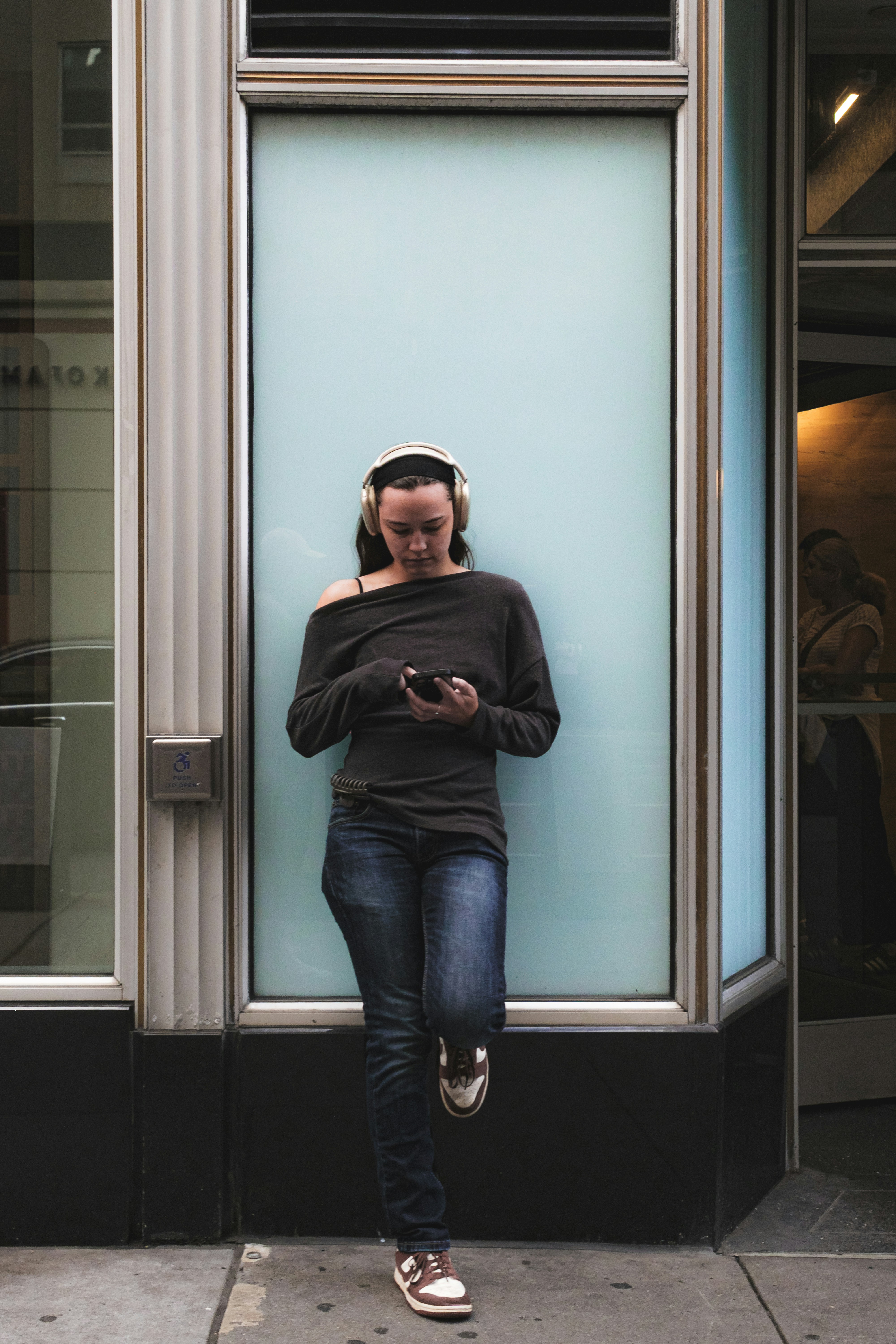 Headphones on the Window Pane: A Quiet Moment in Urban Silence