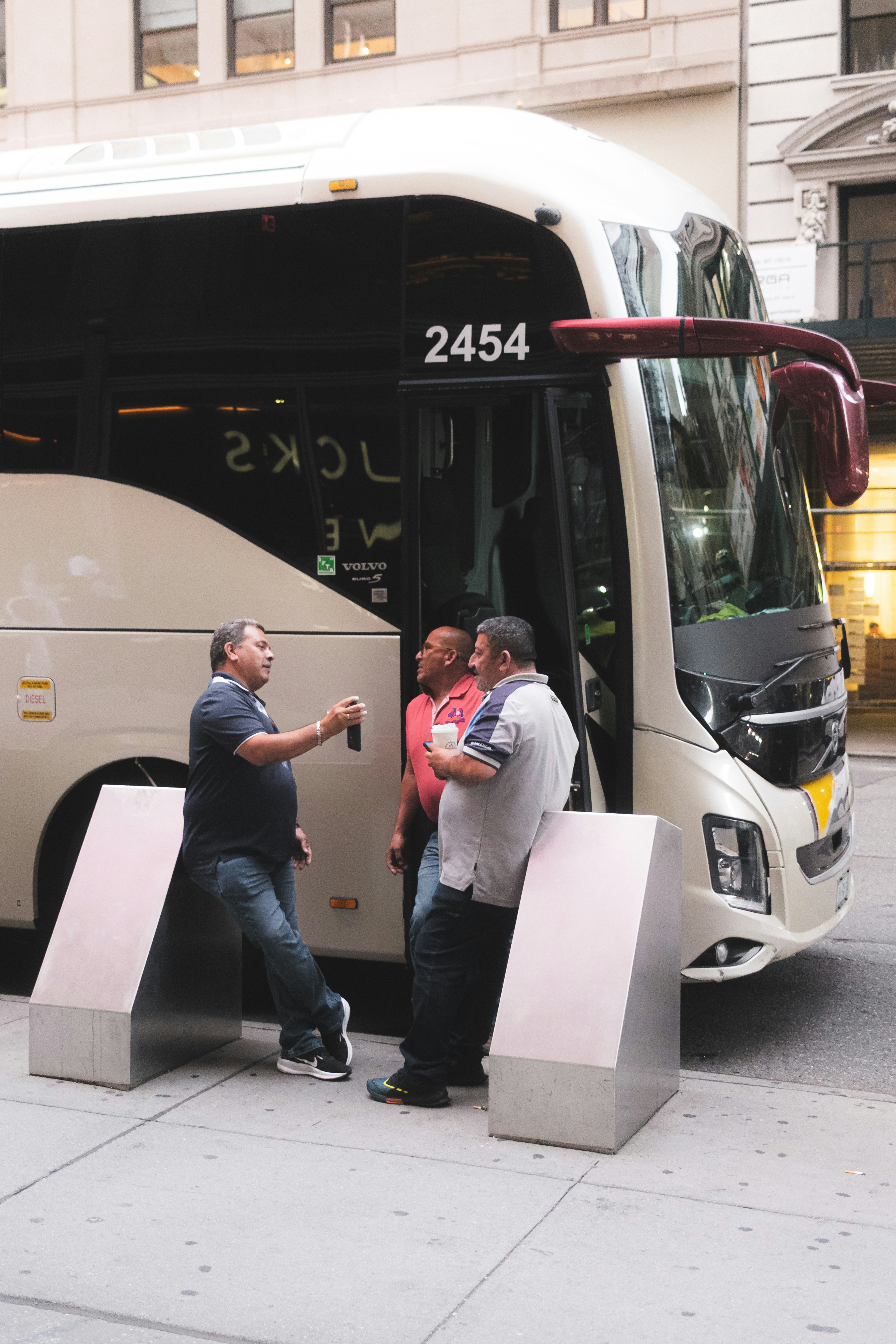 Crew Conversation at Street-Side Bus Stop