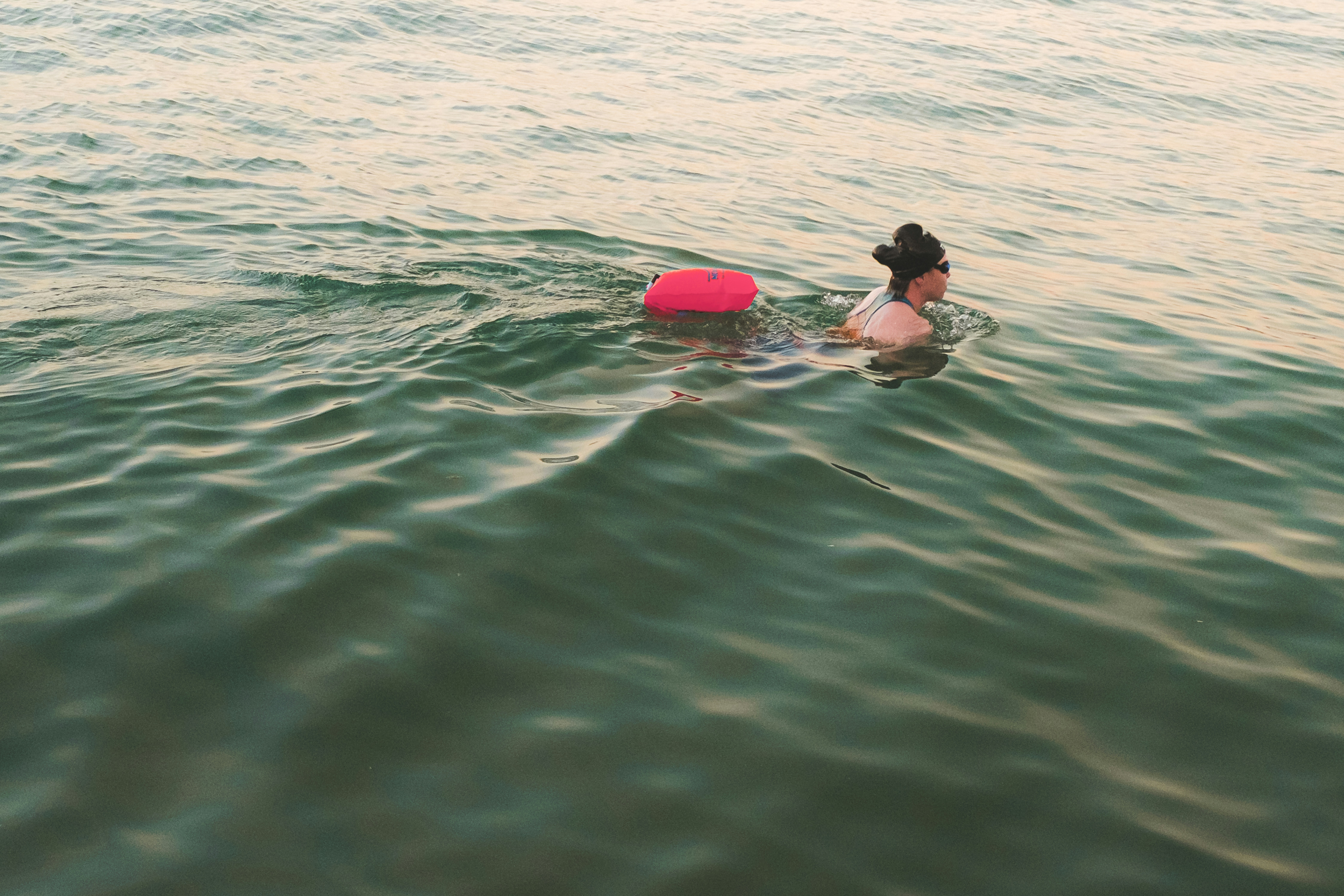 Floating in the Quiet Blue: A Solo Swimmer's Moment Beyond the Break