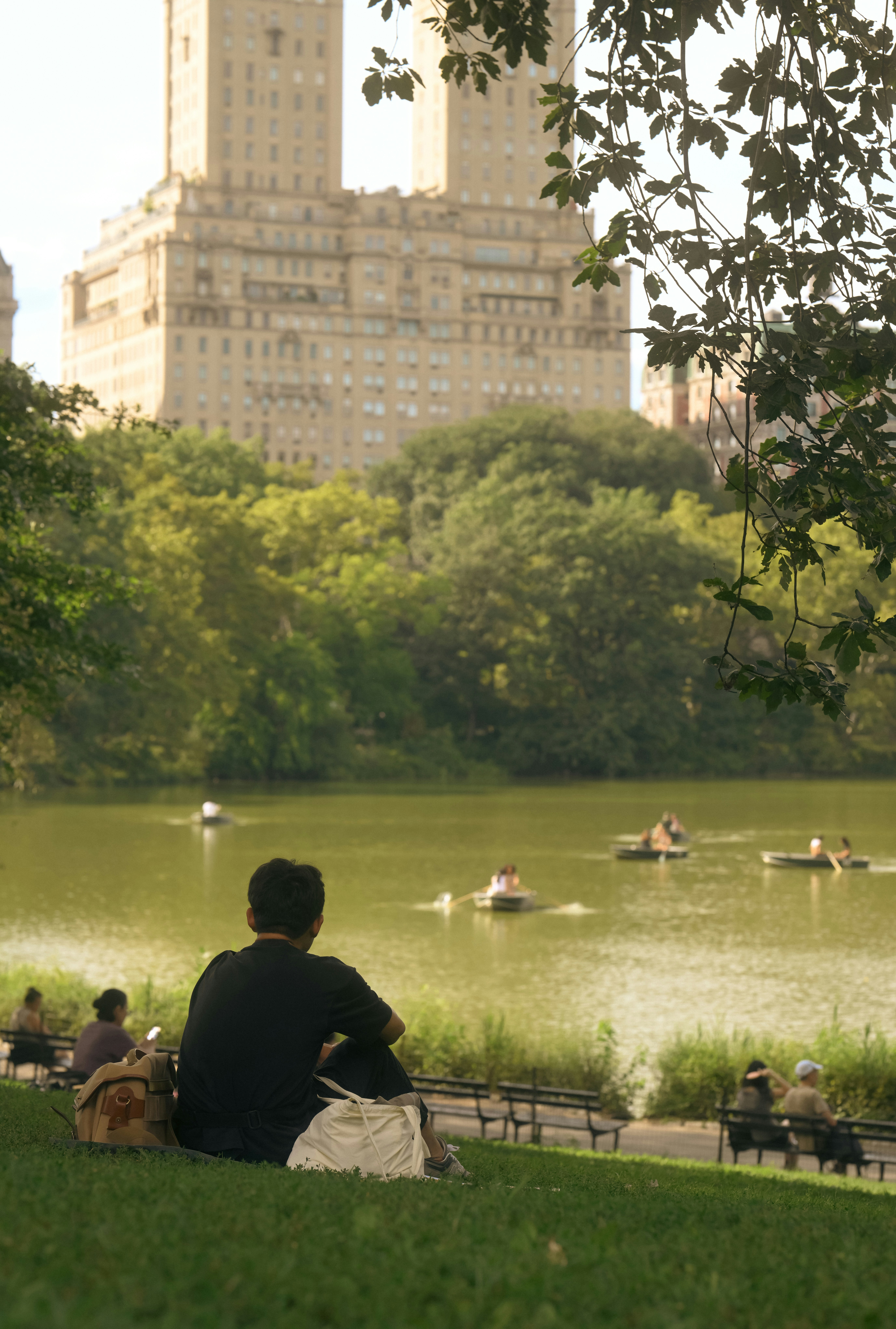 Quiet Conversation by the Riverside with City Towers in the Distance