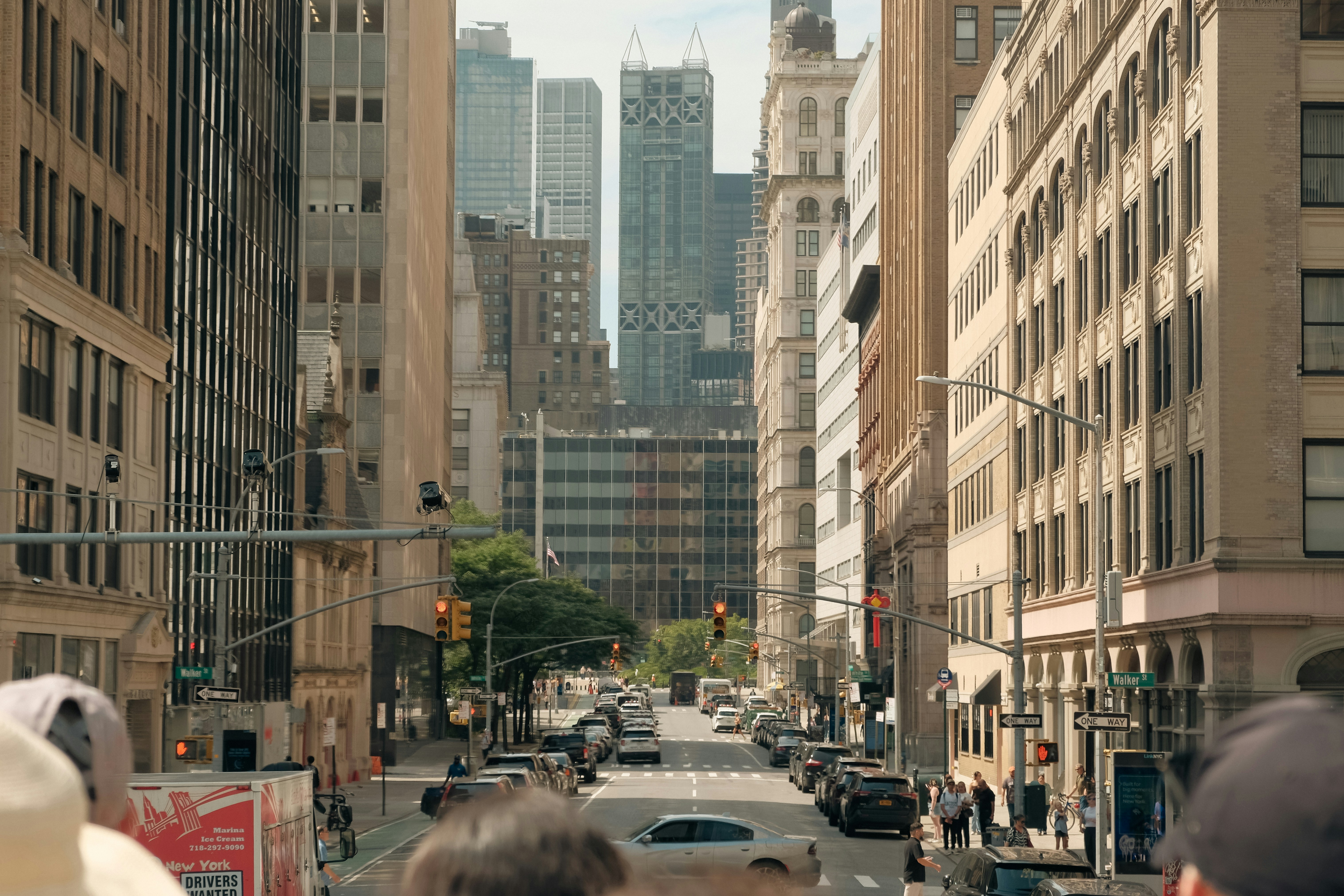 Urban Confluence: A City Street Framed by Skyscrapers
