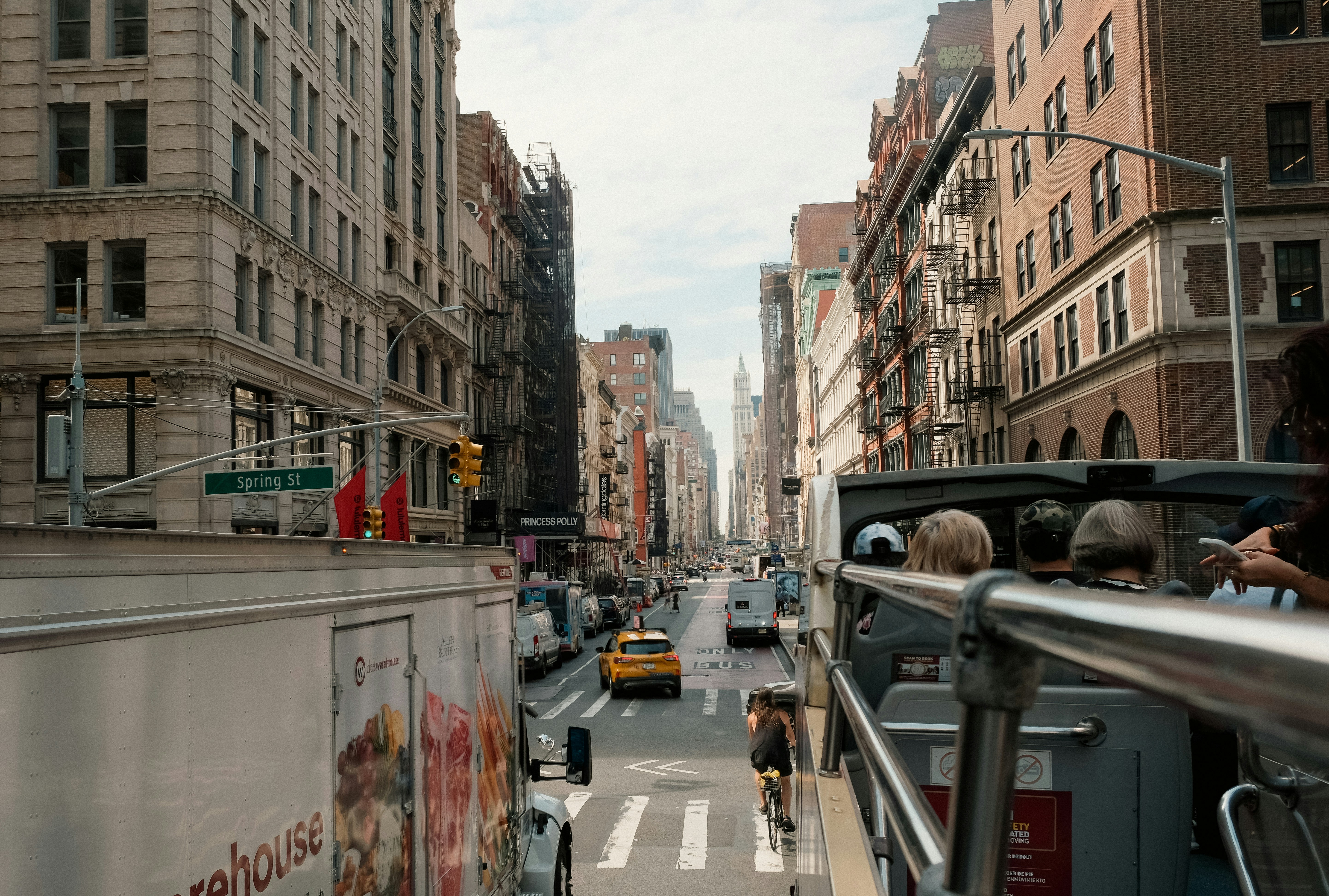 City Street in Motion: A Runner, Taxi, and Urban Flux