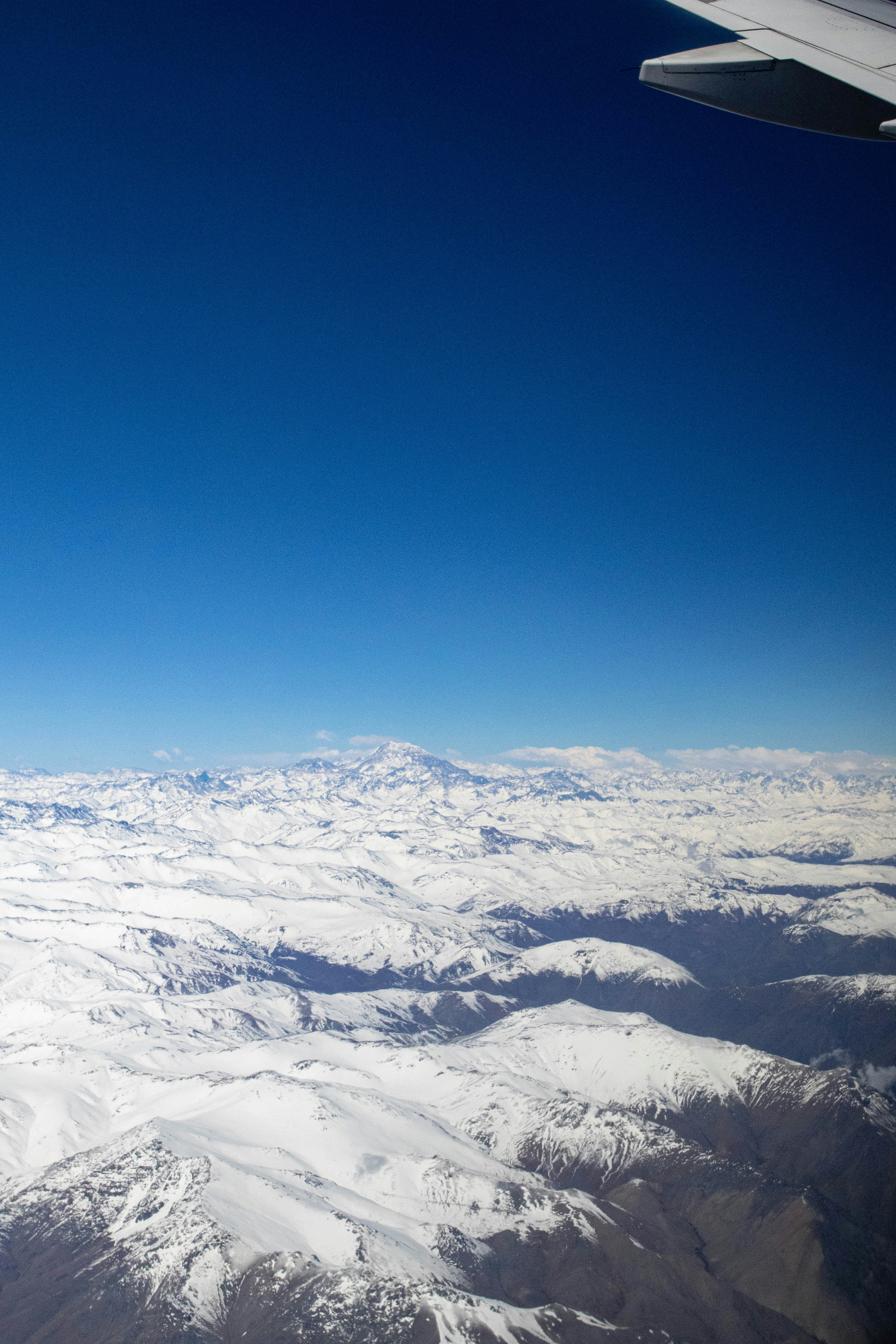 Above the Peaks: Snow-Capped Front Range from a Window Seat