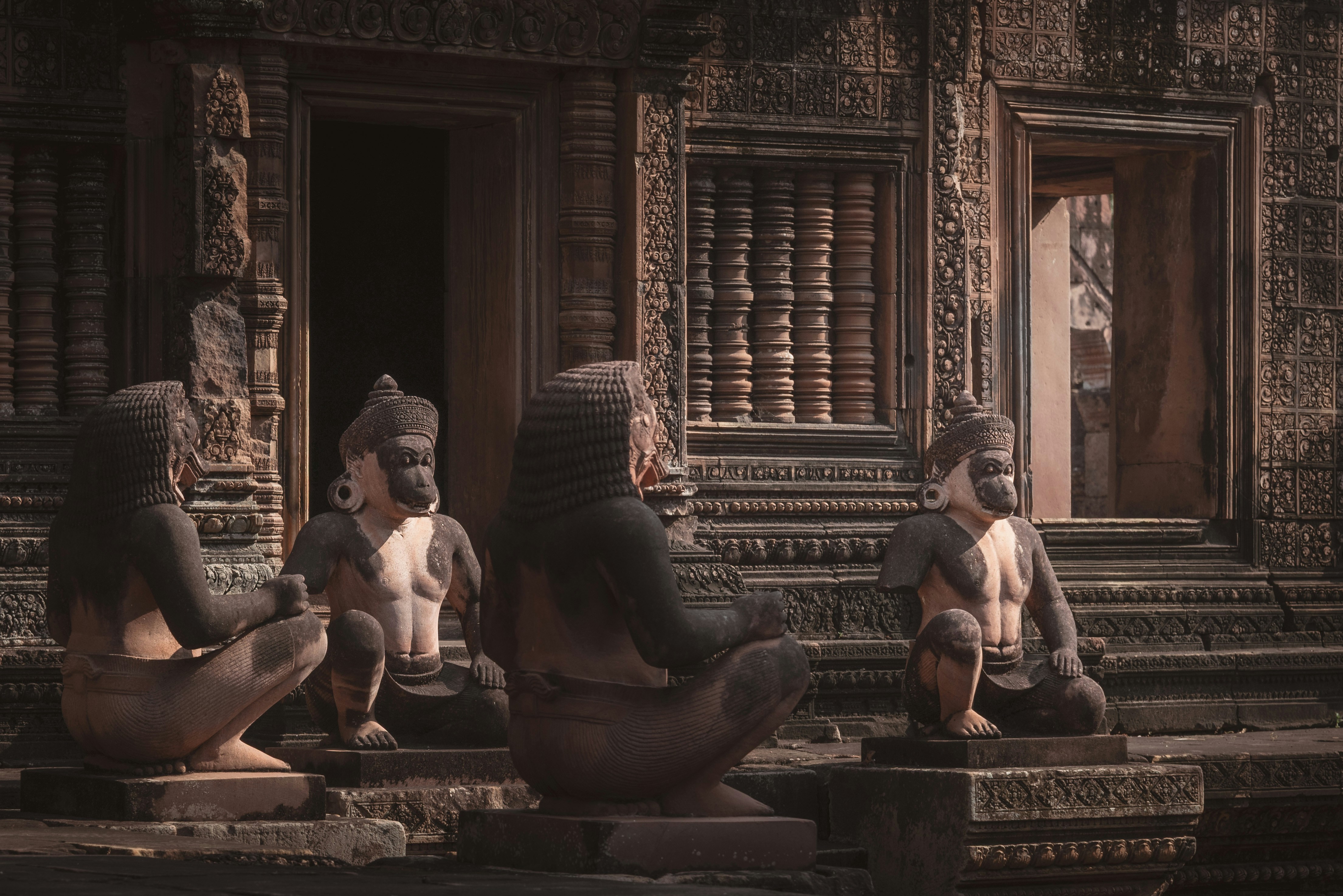 Temple Statues in Shaded Courtyard