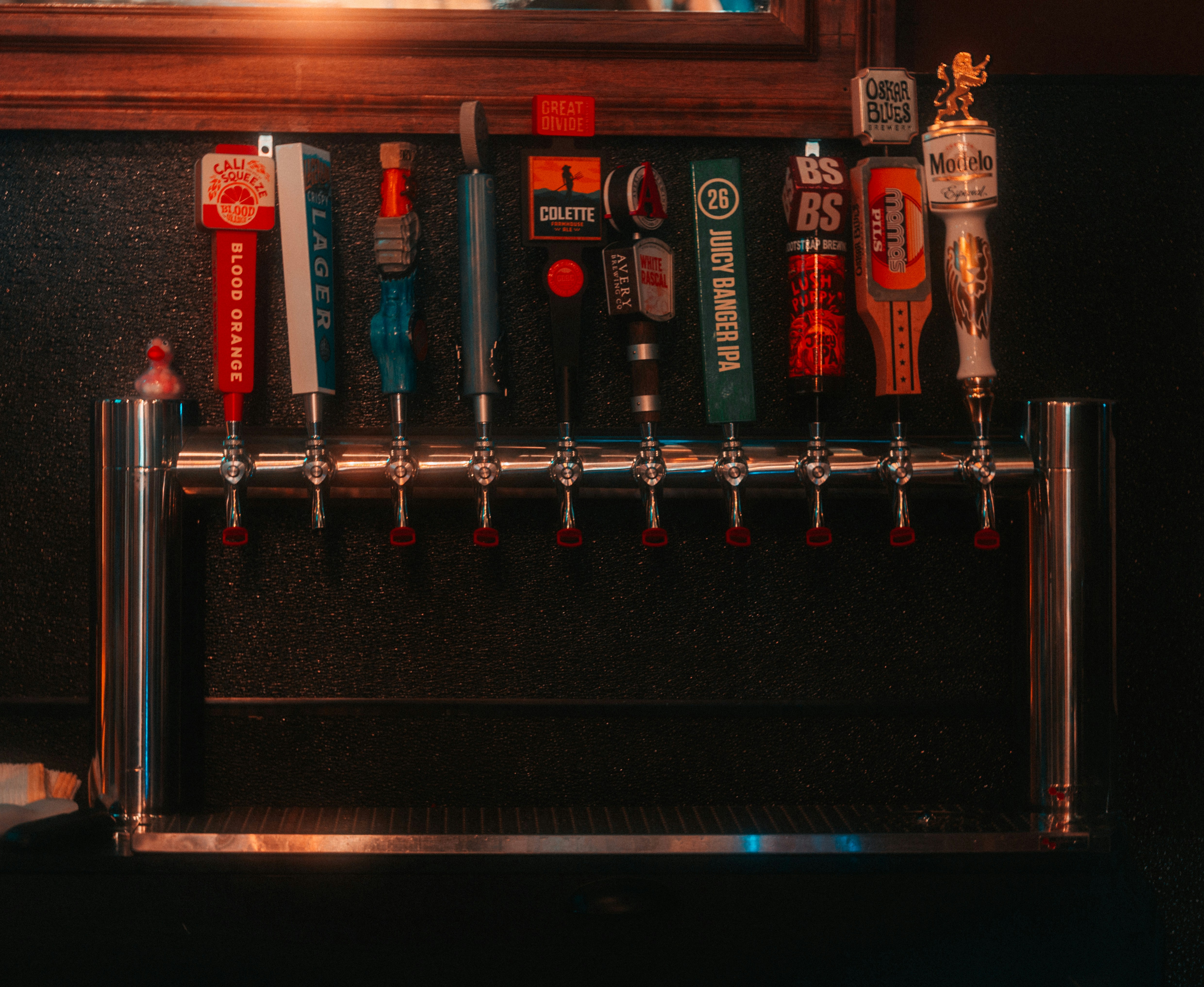 Taproom Parade: A Row of Beer Taps with Colorful Handles