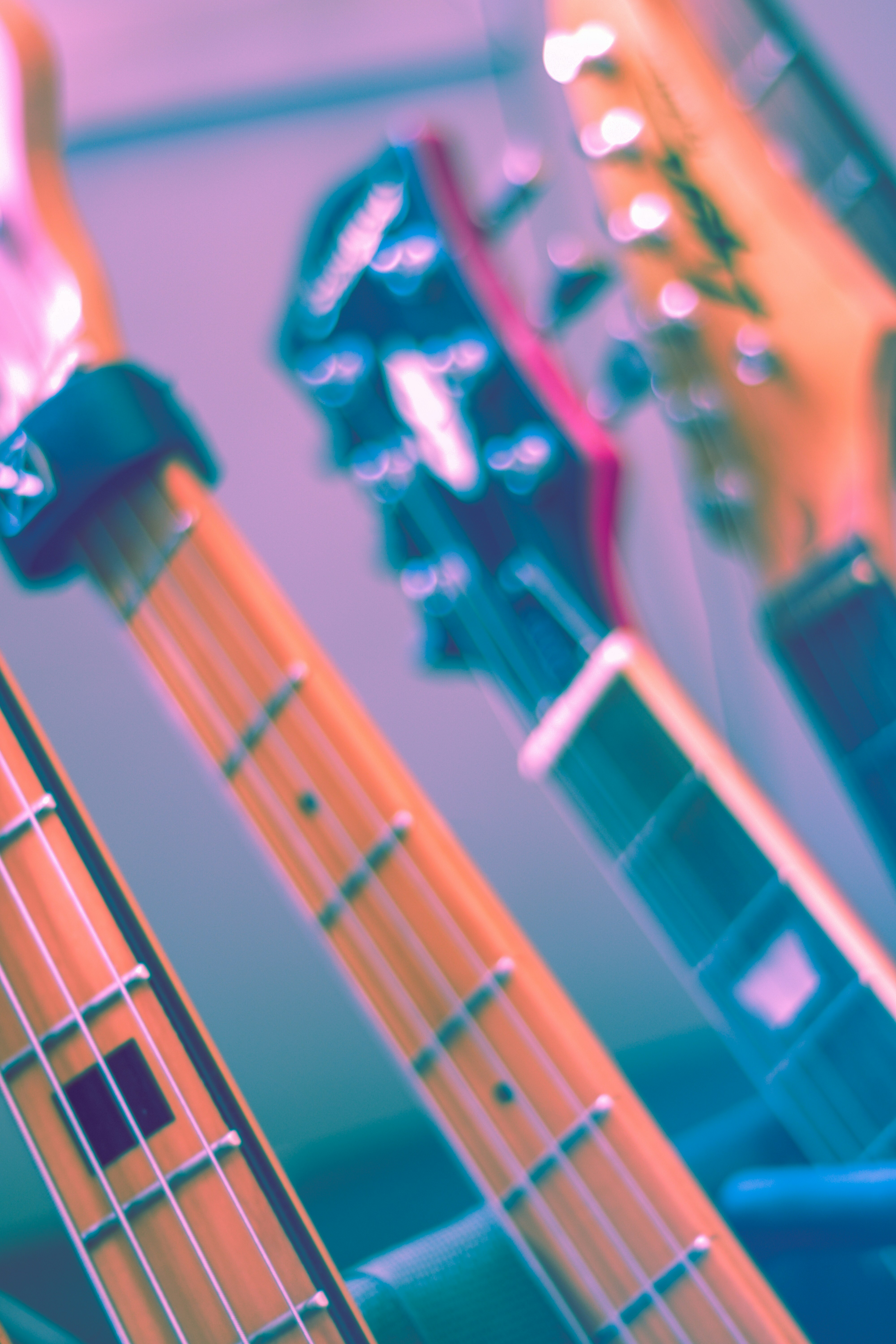 Strings in Neon: Blur of a Guitar Still Life