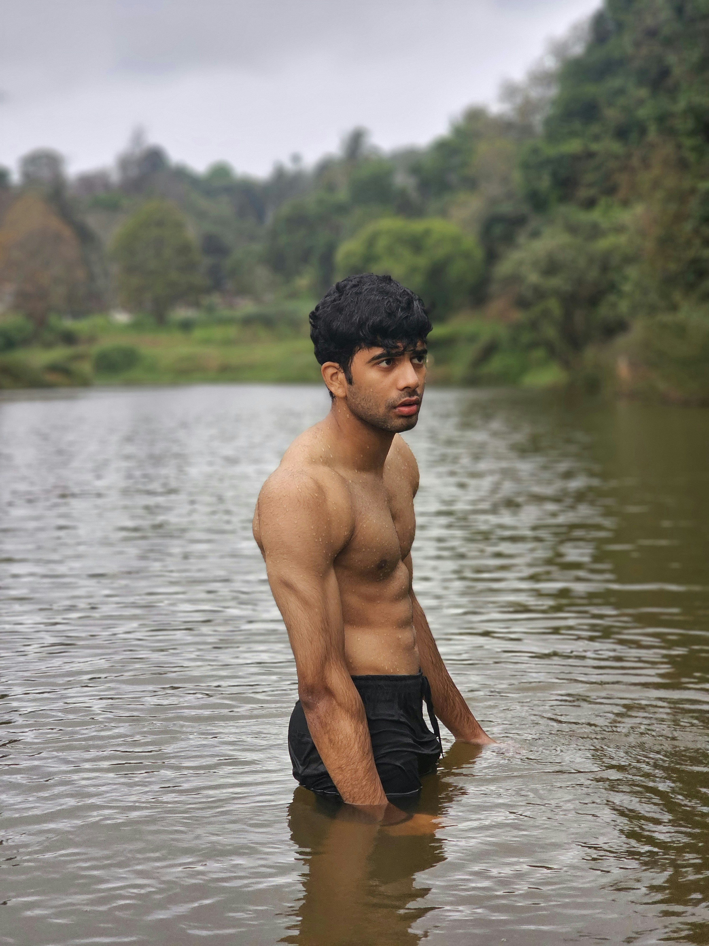 Lone River Warrior: Portrait of Stillness in Moving Waters