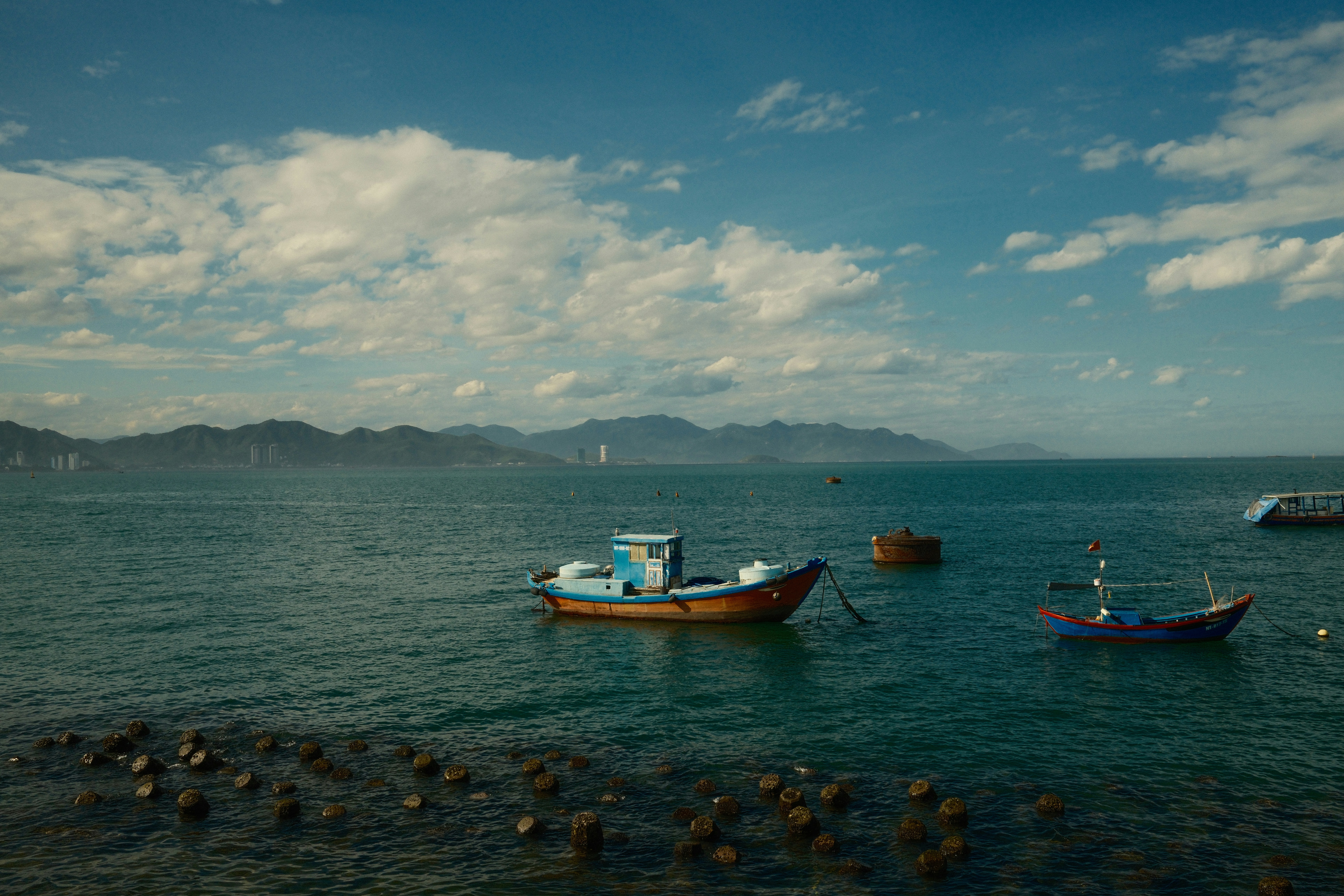 Harbor at Dusk: Small Boats Rest on a Quiet Sea