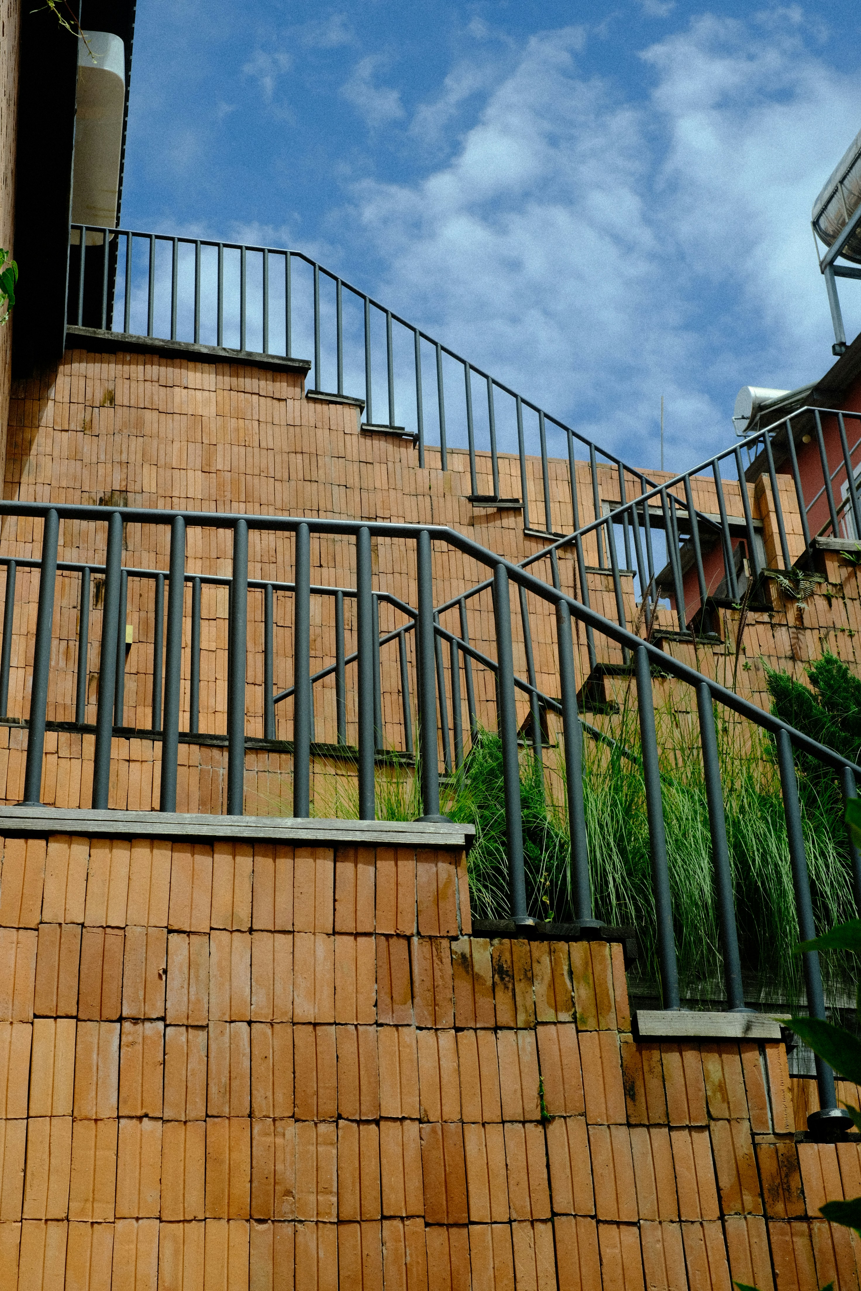 Terraced Ramps and Steel Railing Against a Blue Sky