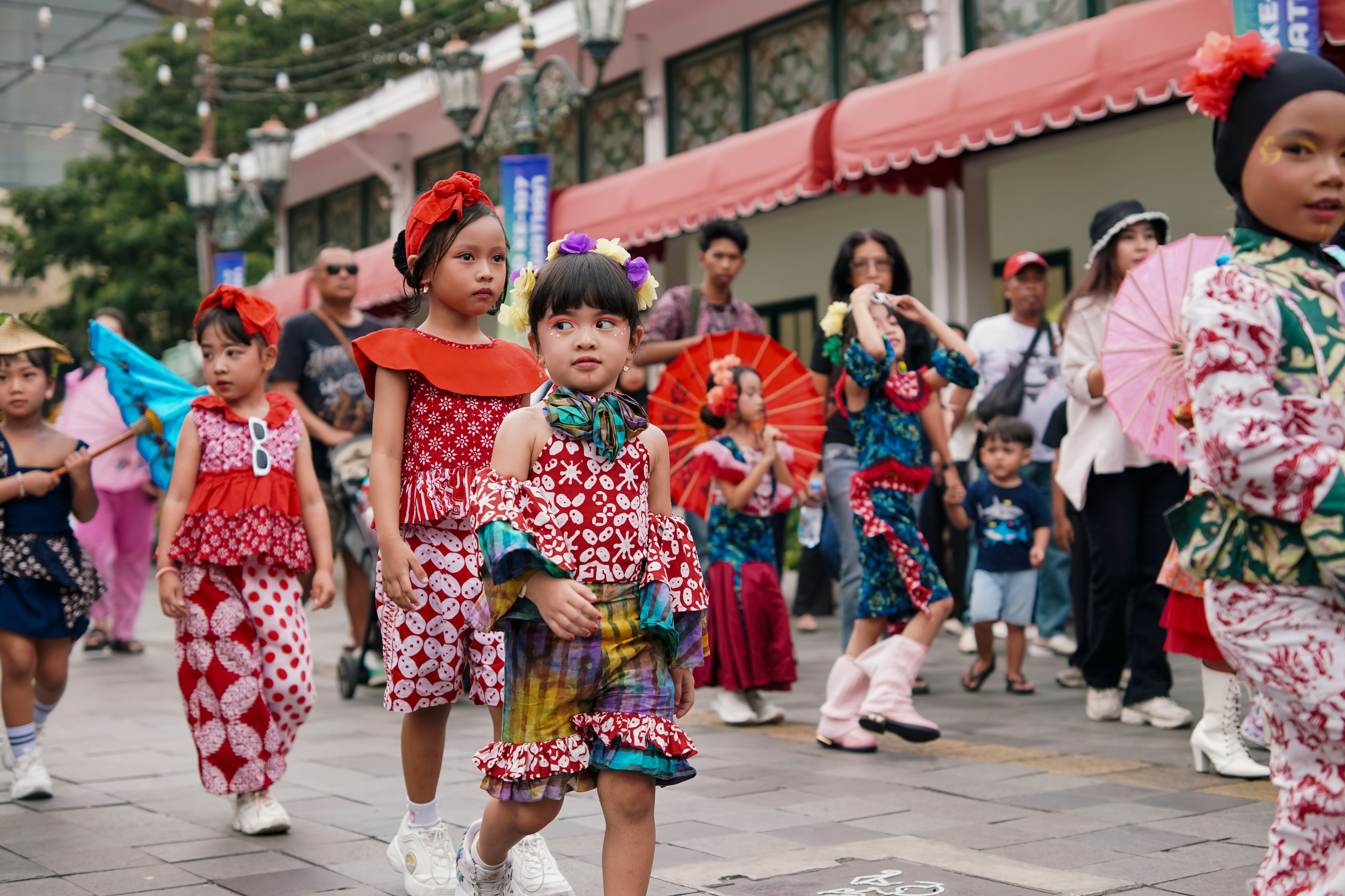 Colorful Parade of Dancers in a Lively Street