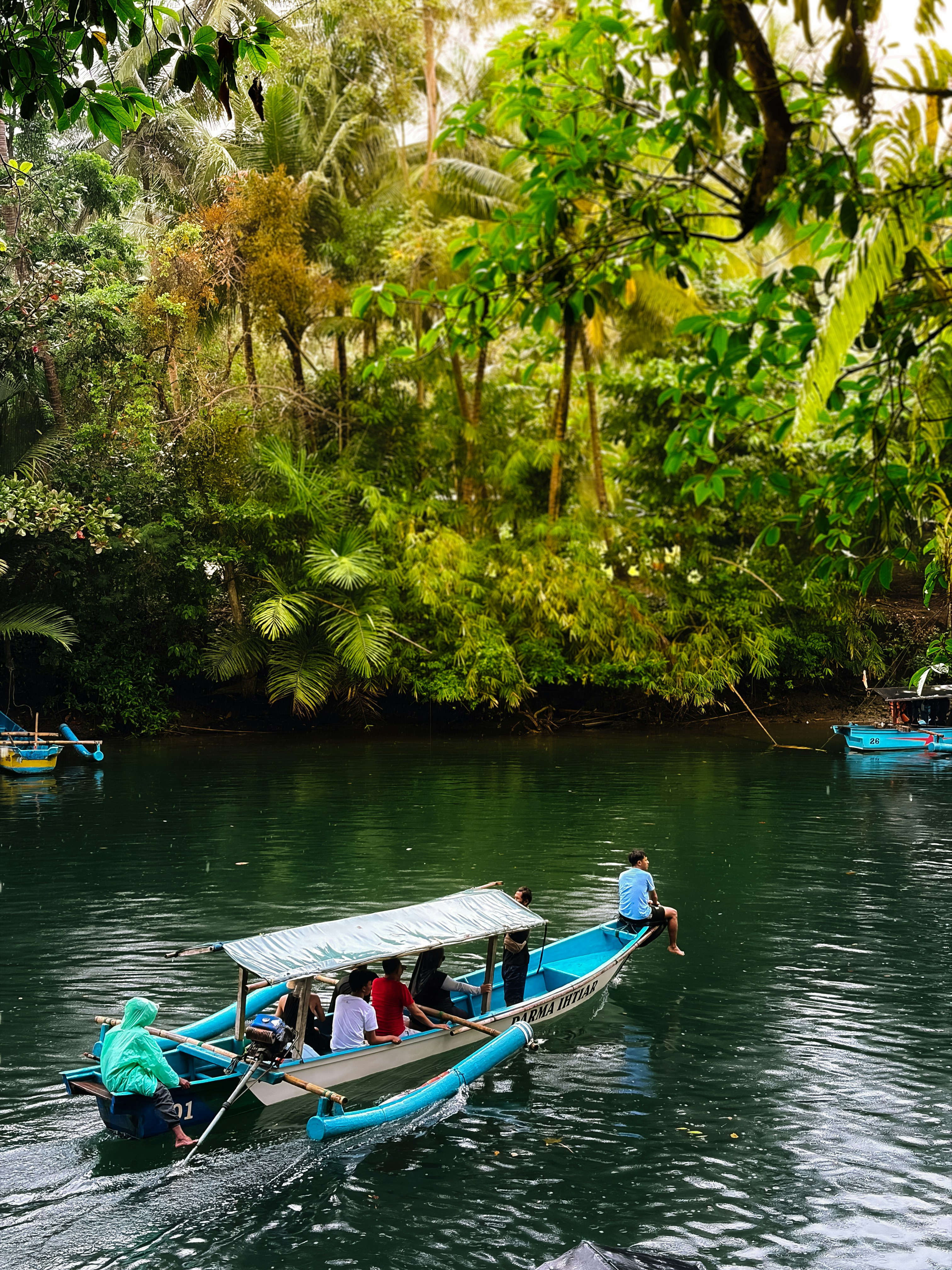 Riverbound Rowers: A Leafy Oasis Ferrying Life
