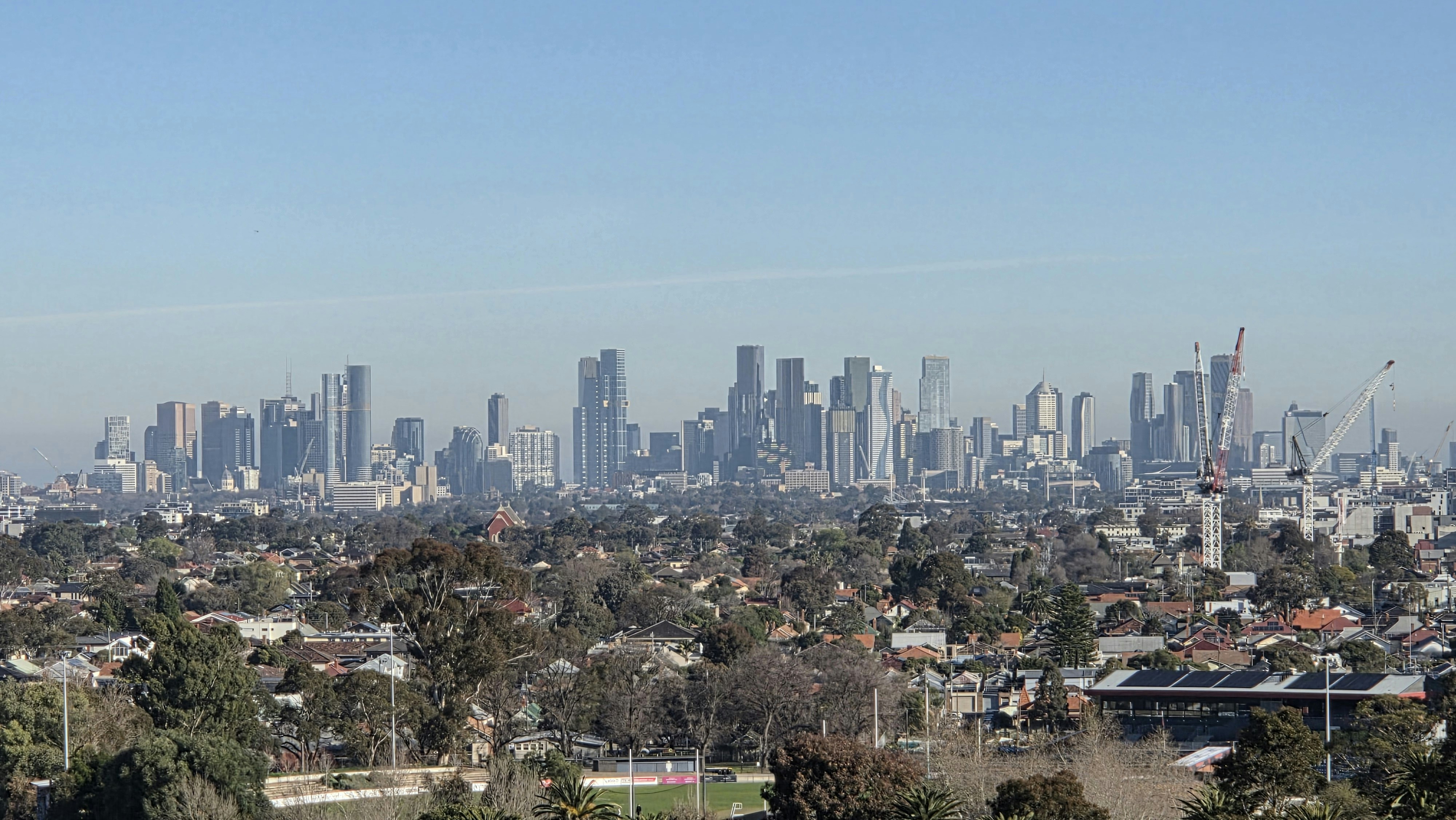 Distant Skyscraper Chorus Across a Suburban Horizon