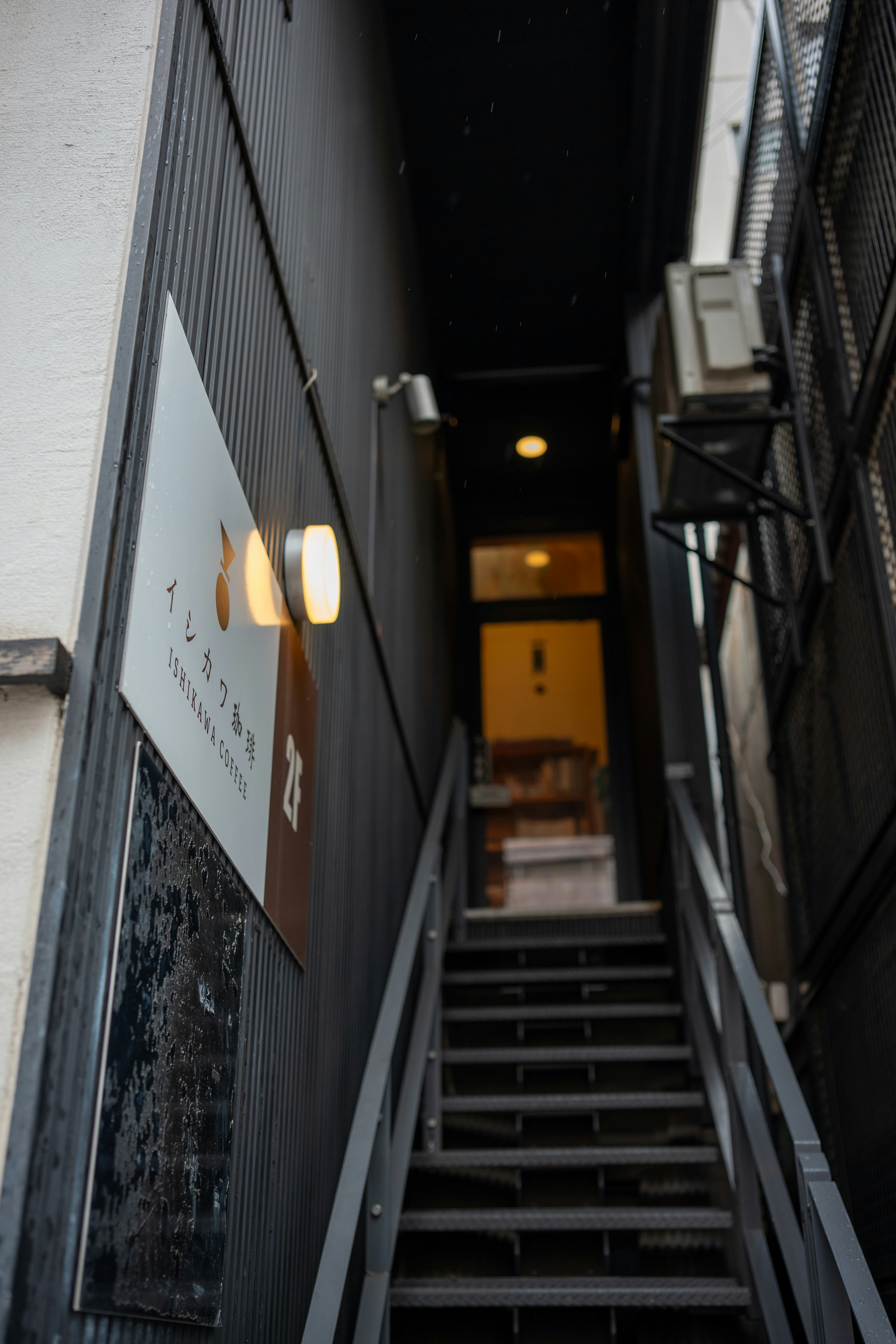 Upward Ascent: Stairwell View Toward a Hidden Doorway