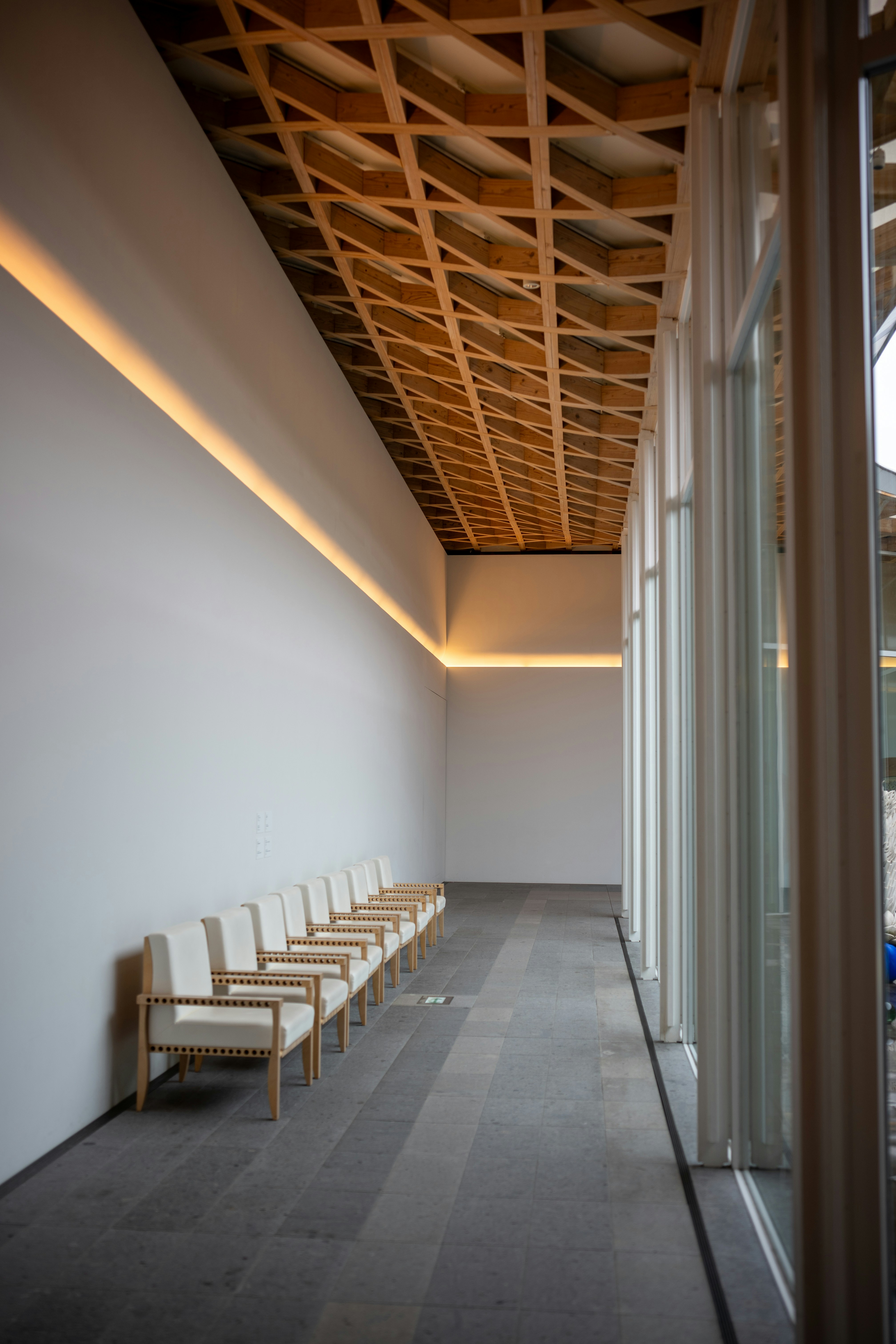 Quiet Corridor: Modern Light and Wood in a Sunlit Gallery