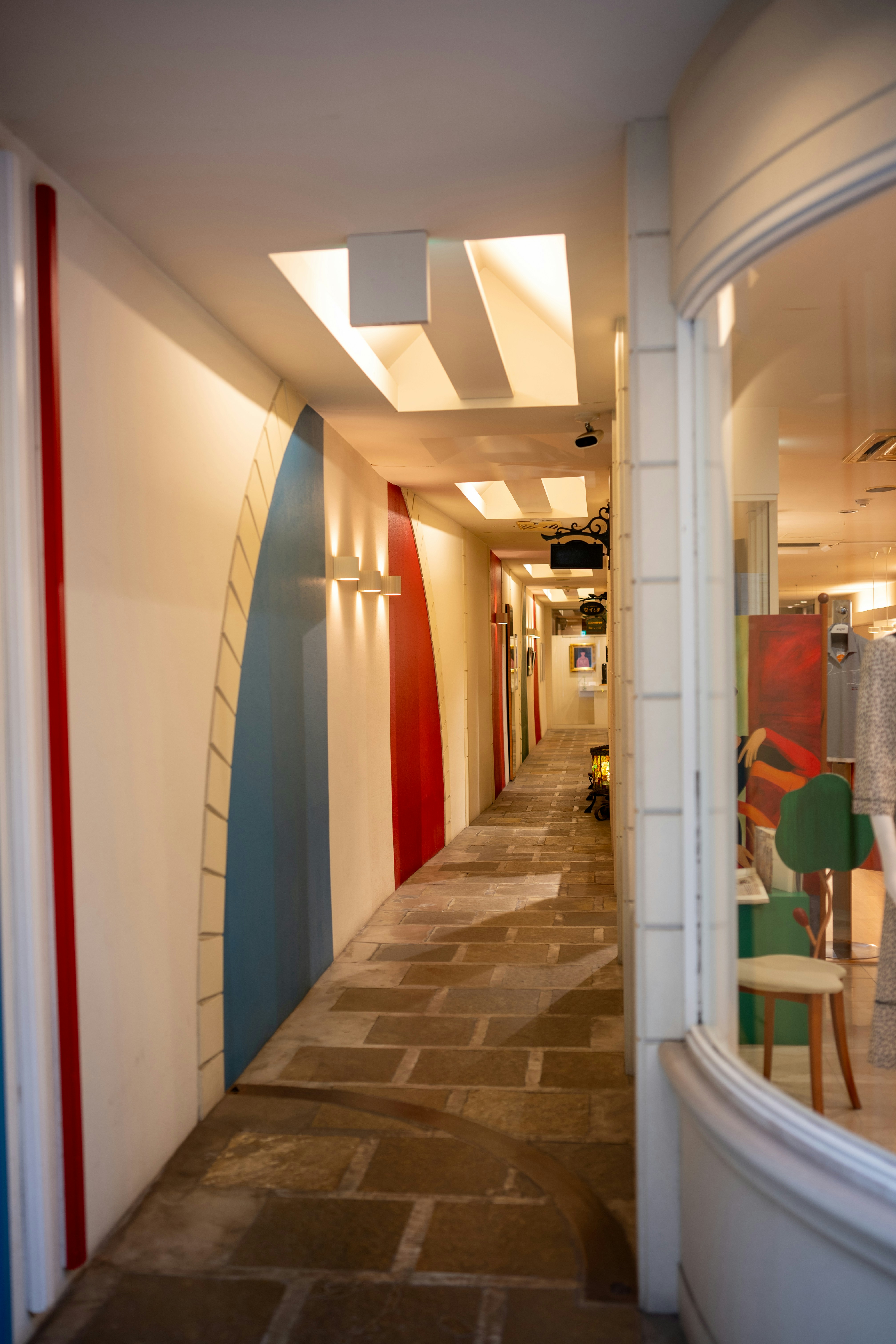 Ornamental Gallery Corridor: Colorful Arches Recede into Light