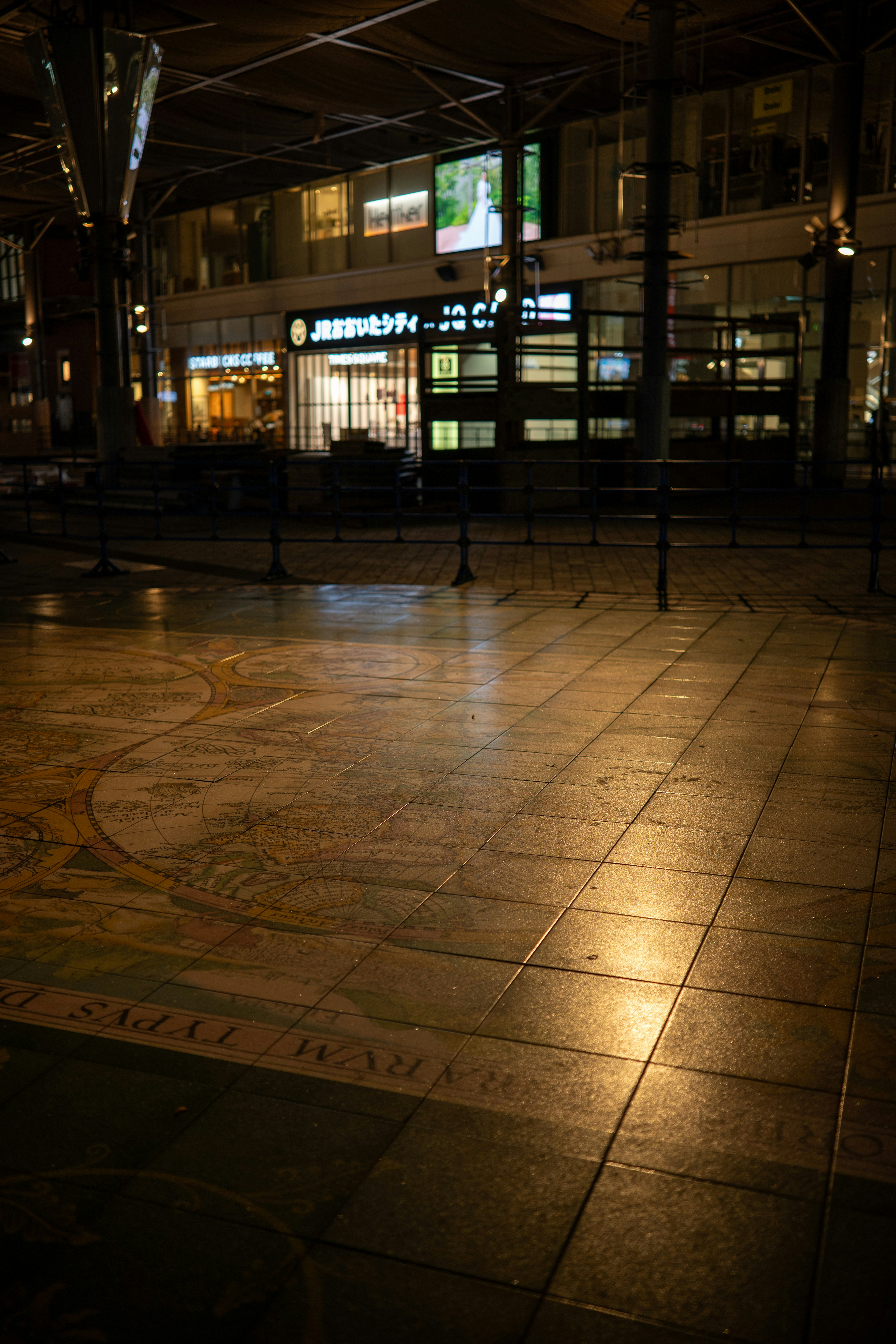 Midnight Promenade: Quiet City Entrance Under Warm Neon