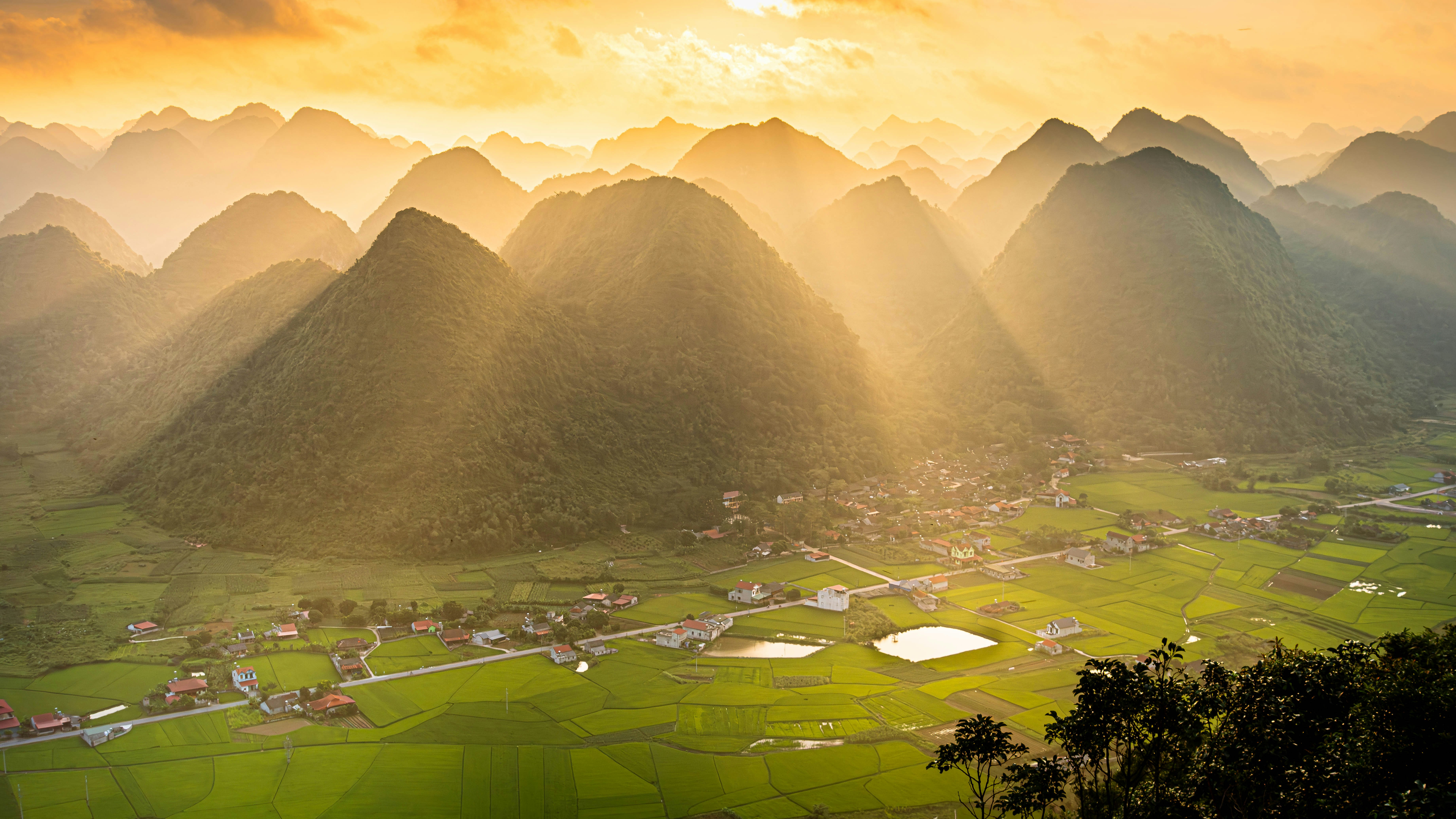Sunlit Valleys Behind a Sea of Karst Peaks at Dusk