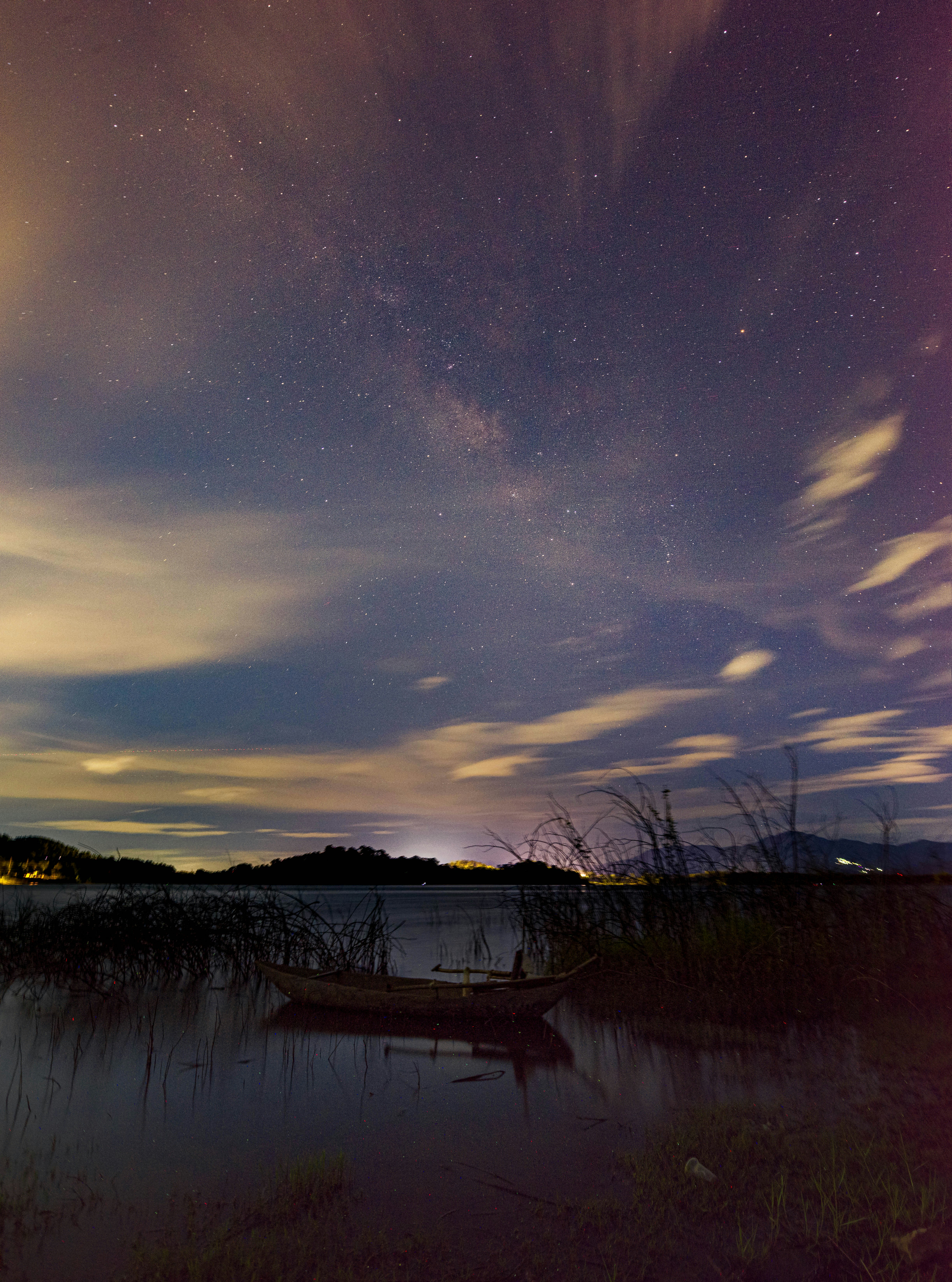 Milky Way Over a Quiet Lake: A Night Boat Beneath Starry Skies