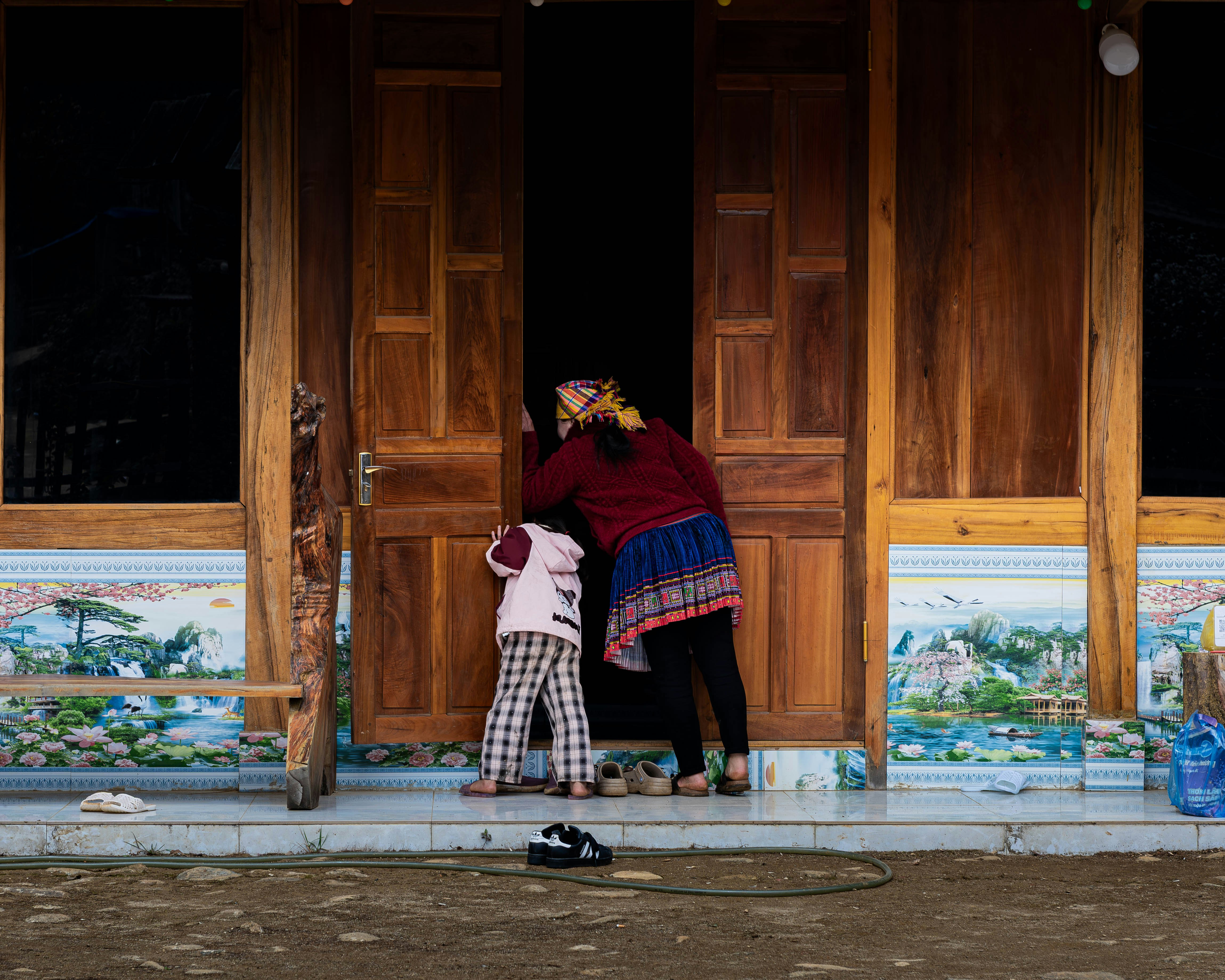 Doorway of Caring: Shared Moment on the Porch
