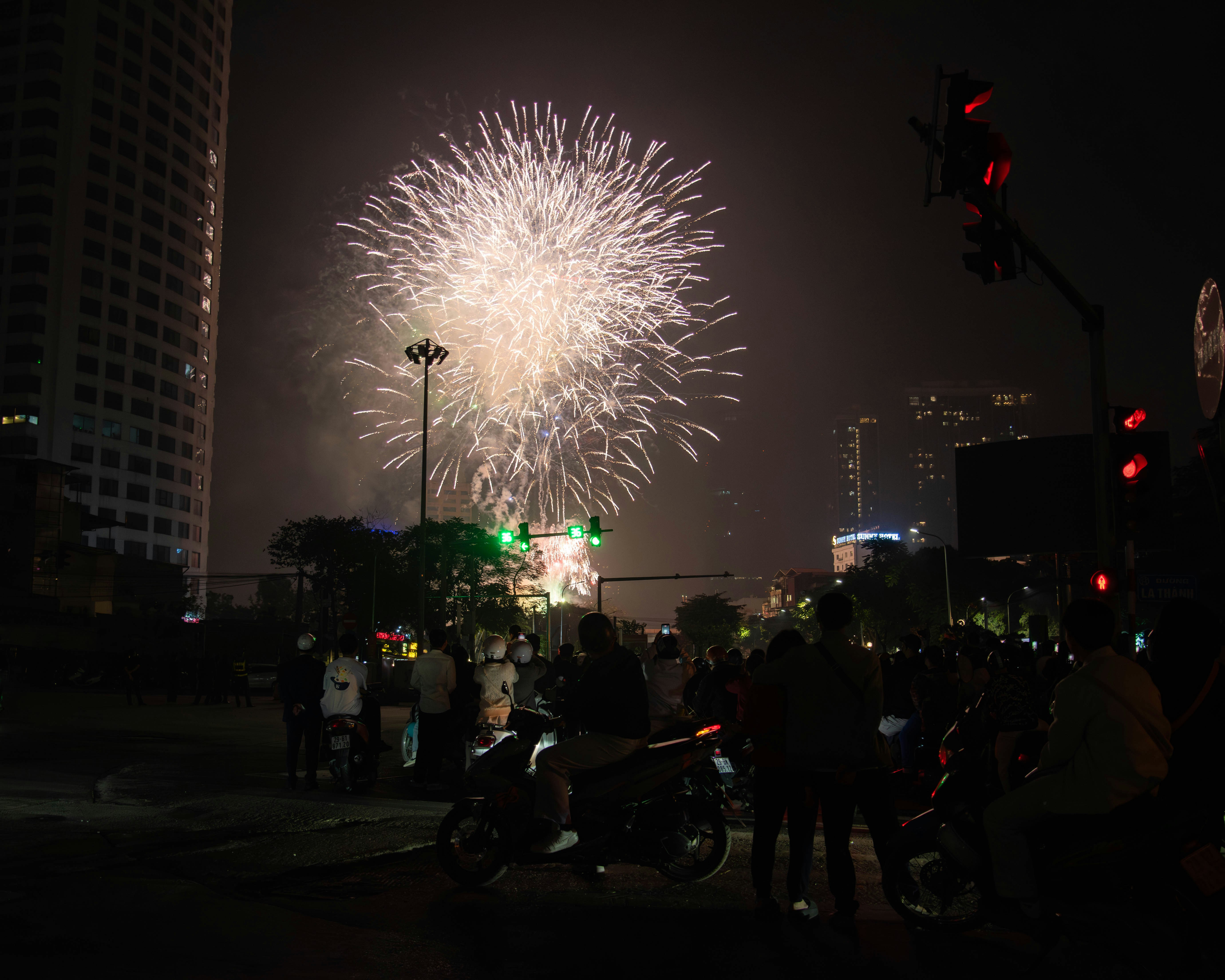 Urban Nightburst: Fireworks Over a CROWDED Street