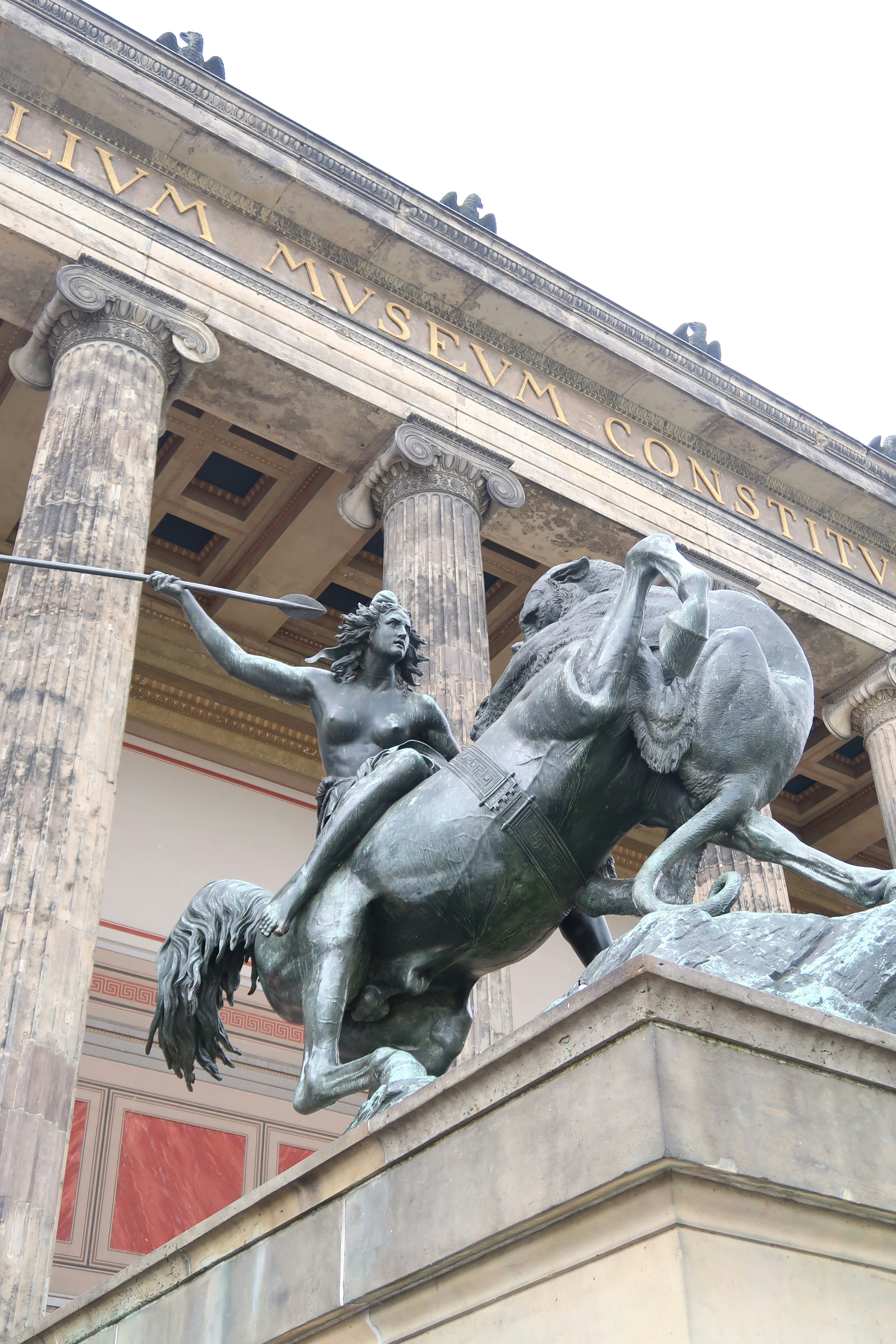 Equestrian Struggle Before a Classical Facade