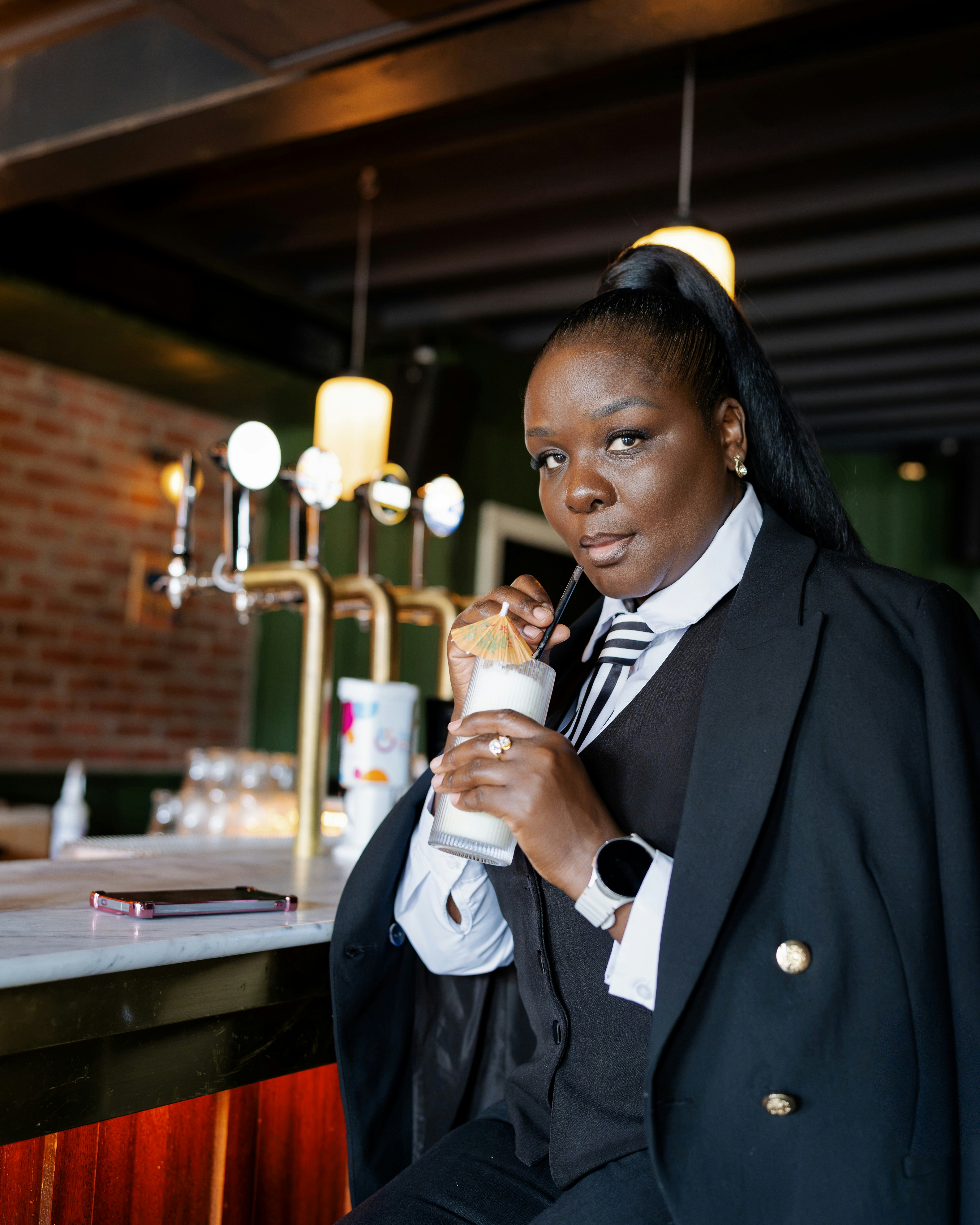 Barmaid in a Sharp Suit Sips a Citrus Espresso Cream