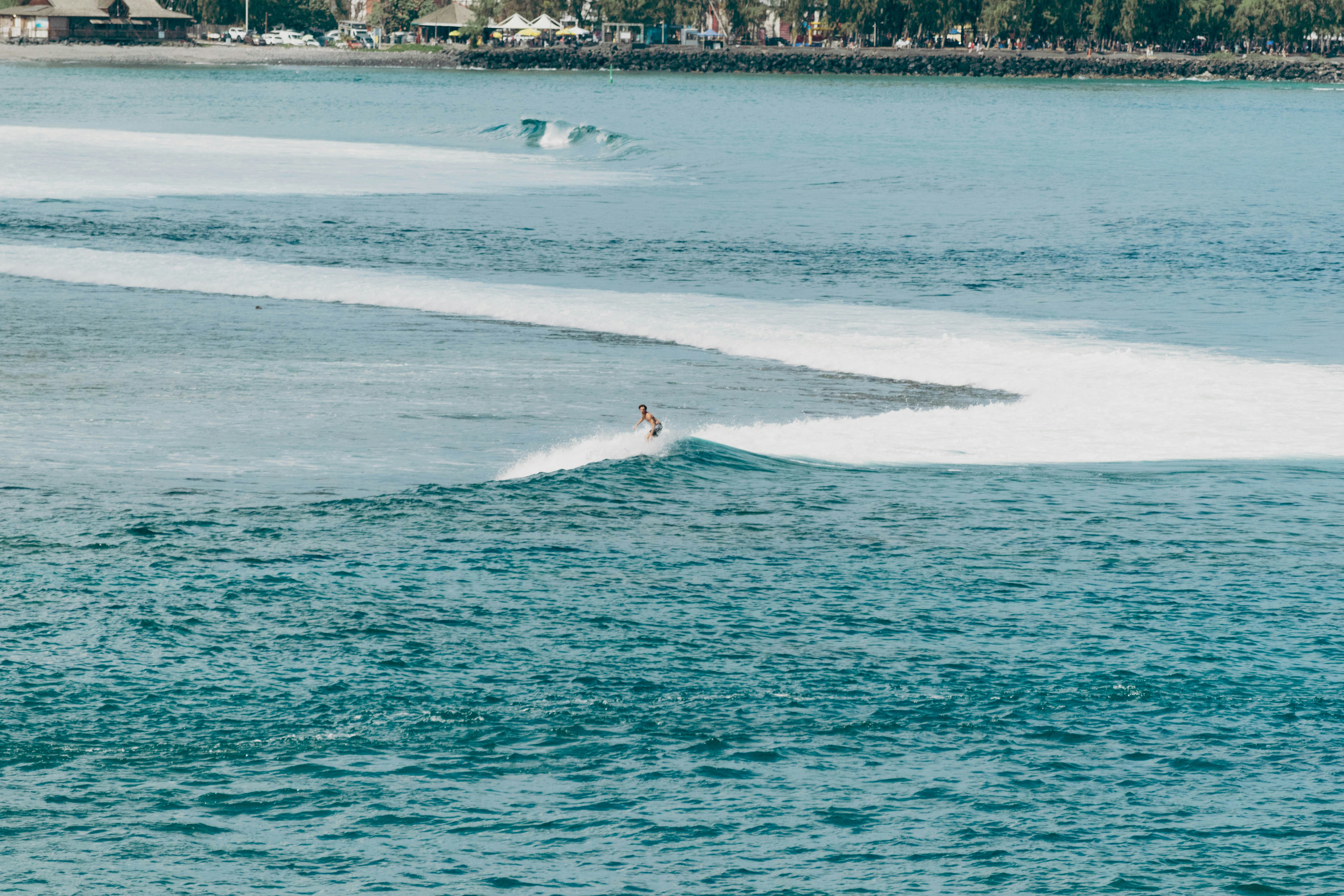 Solitary Surfer on a Crescent Wave