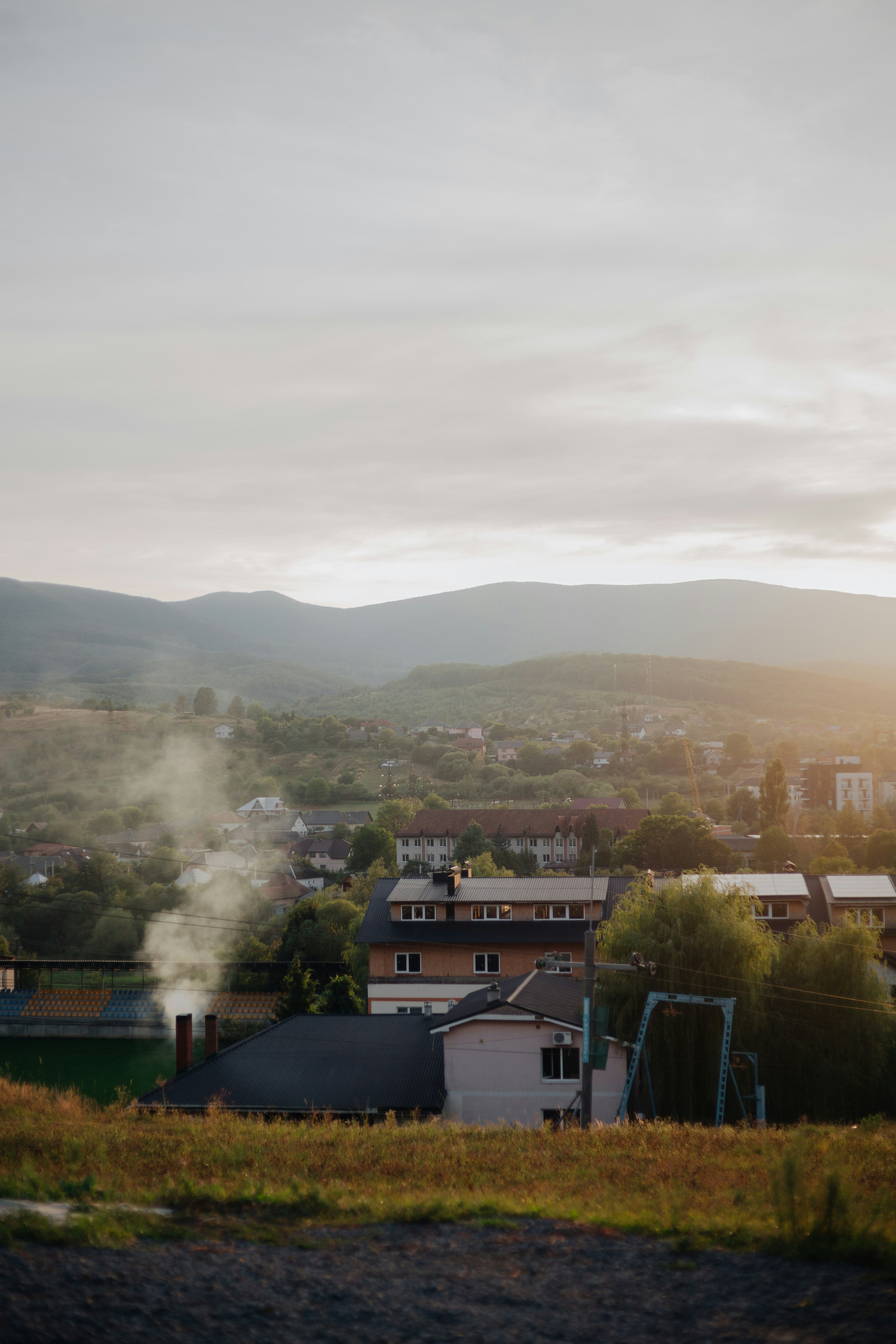 Horizon Smoke and Suburban Quiet at Golden Hour