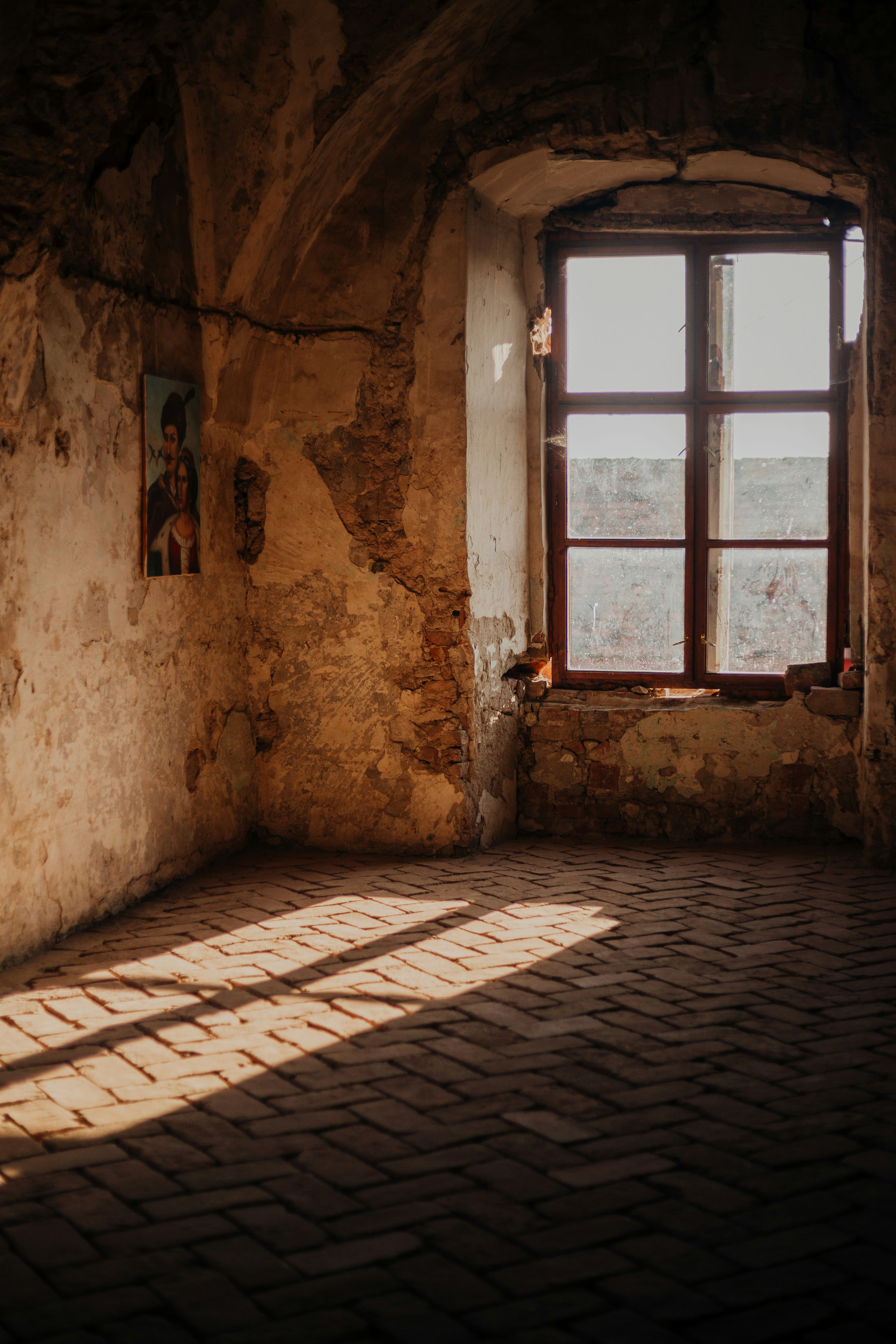 Sunlit Window in a Crumbling Room: Shadows Cast by Time