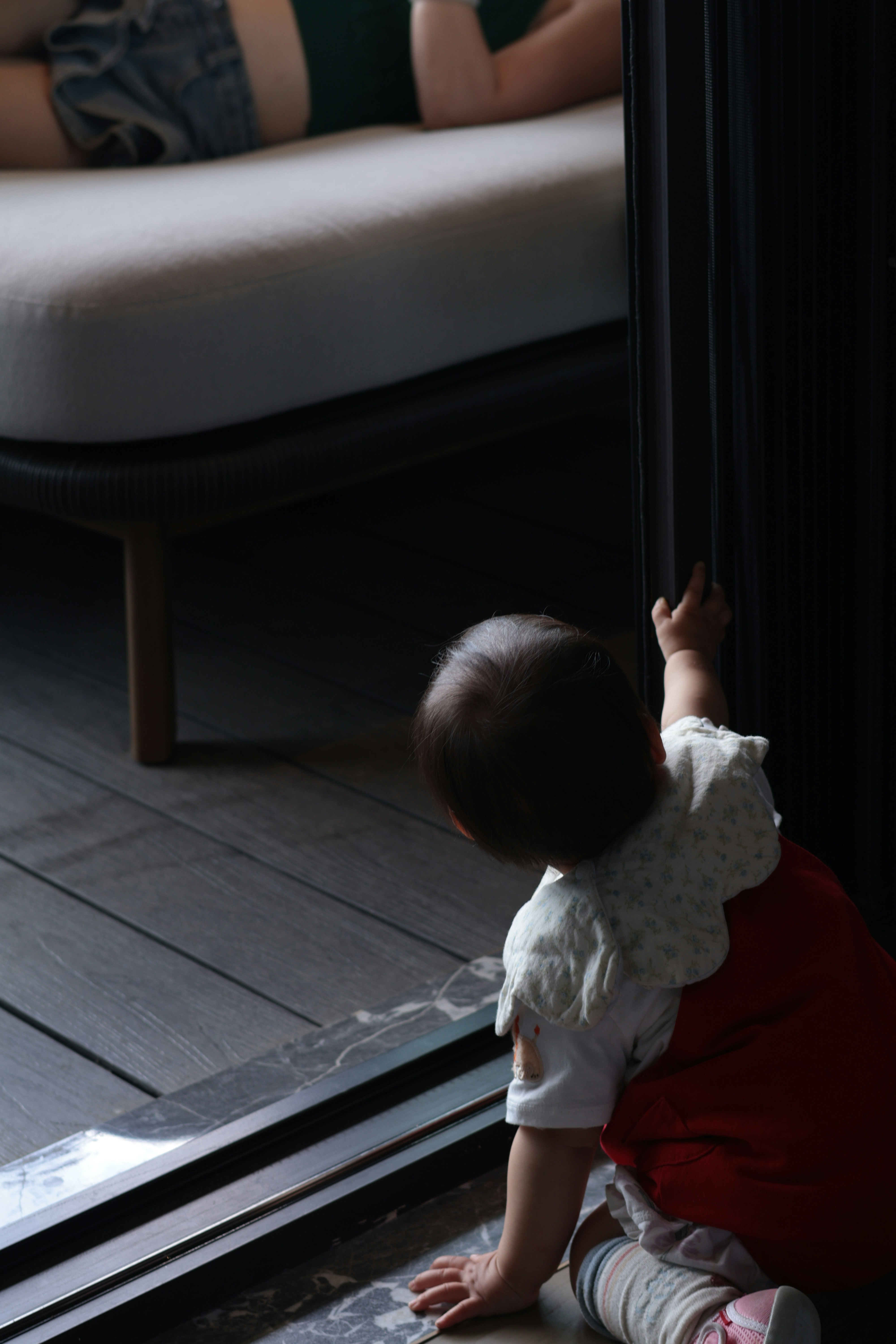Curious Catch: A Baby Reaches for the Curtain Edge
