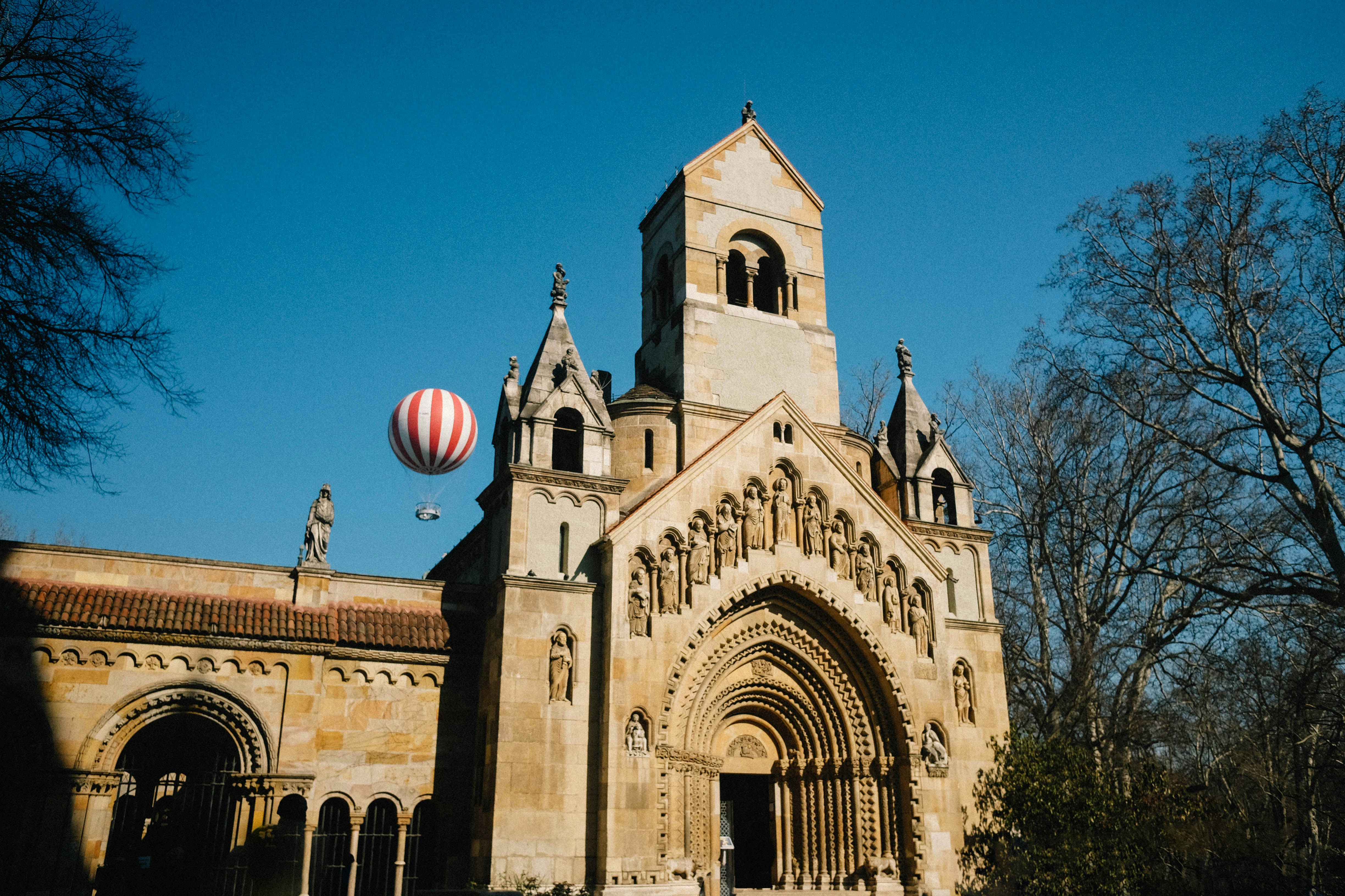 Temple Facade under Blue Sky with Crescent Arch and Balloon
