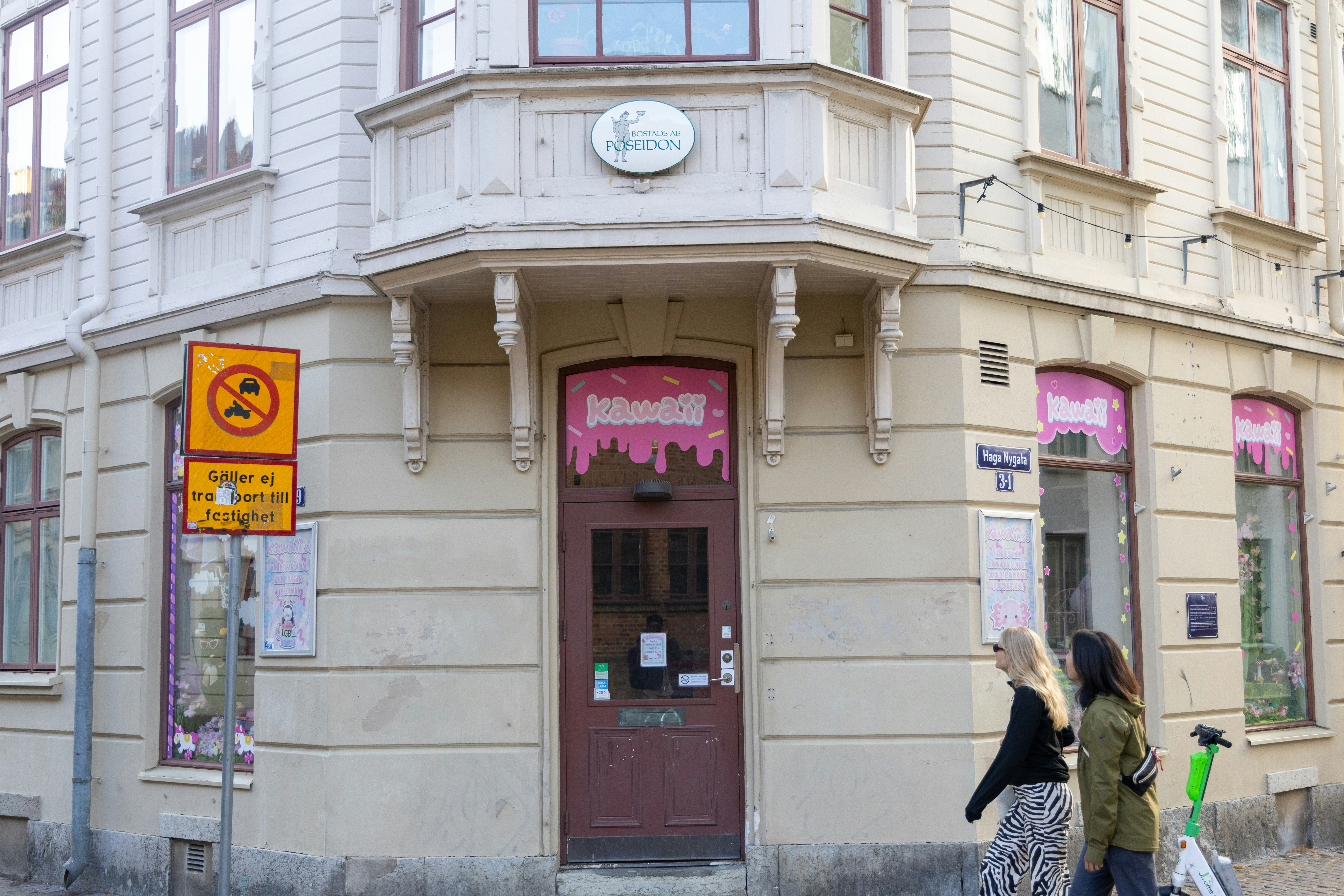 Corner Café Gateway: Two Women Enter a Vintage Streetfront
