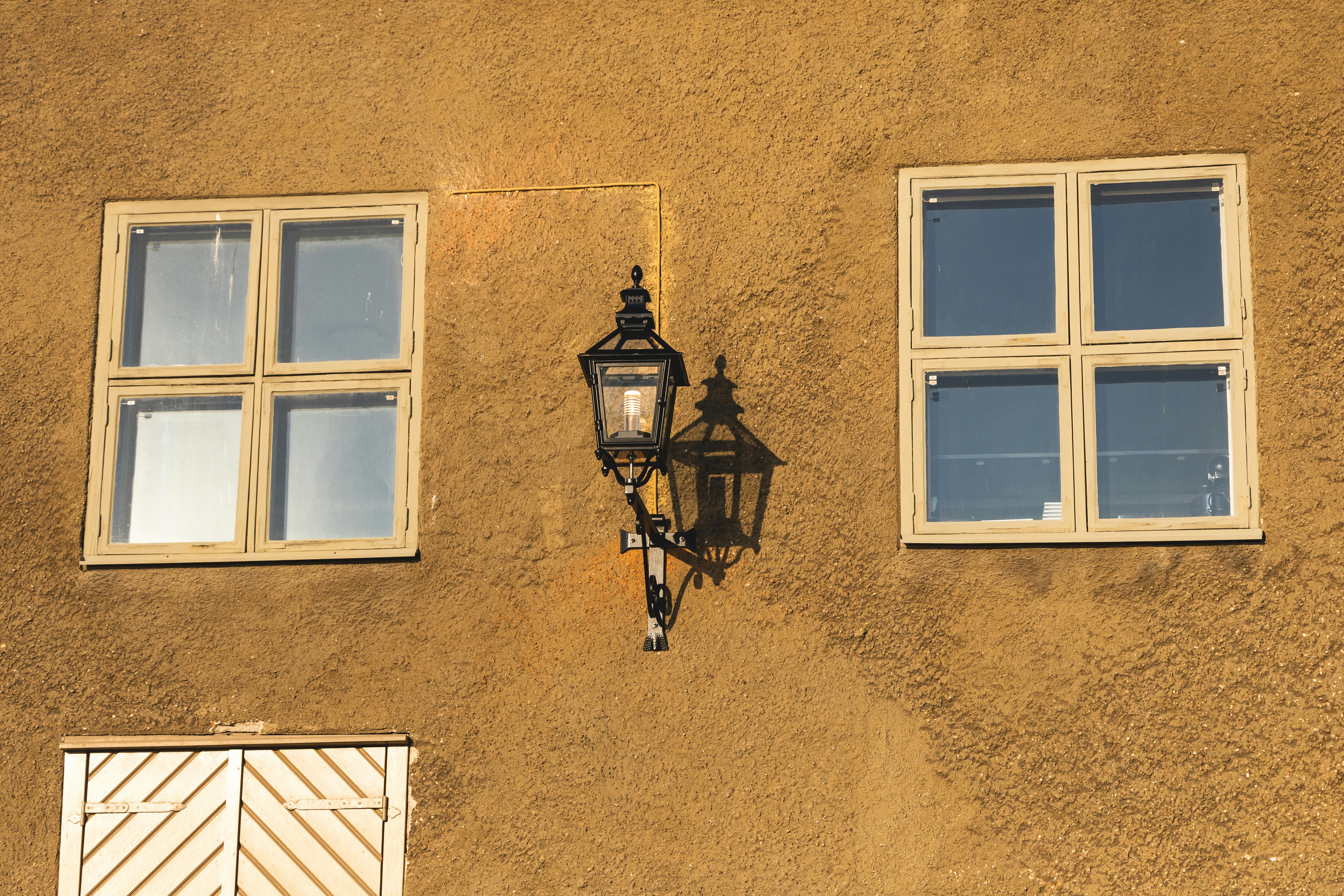Midday Lantern on a Golden Facade