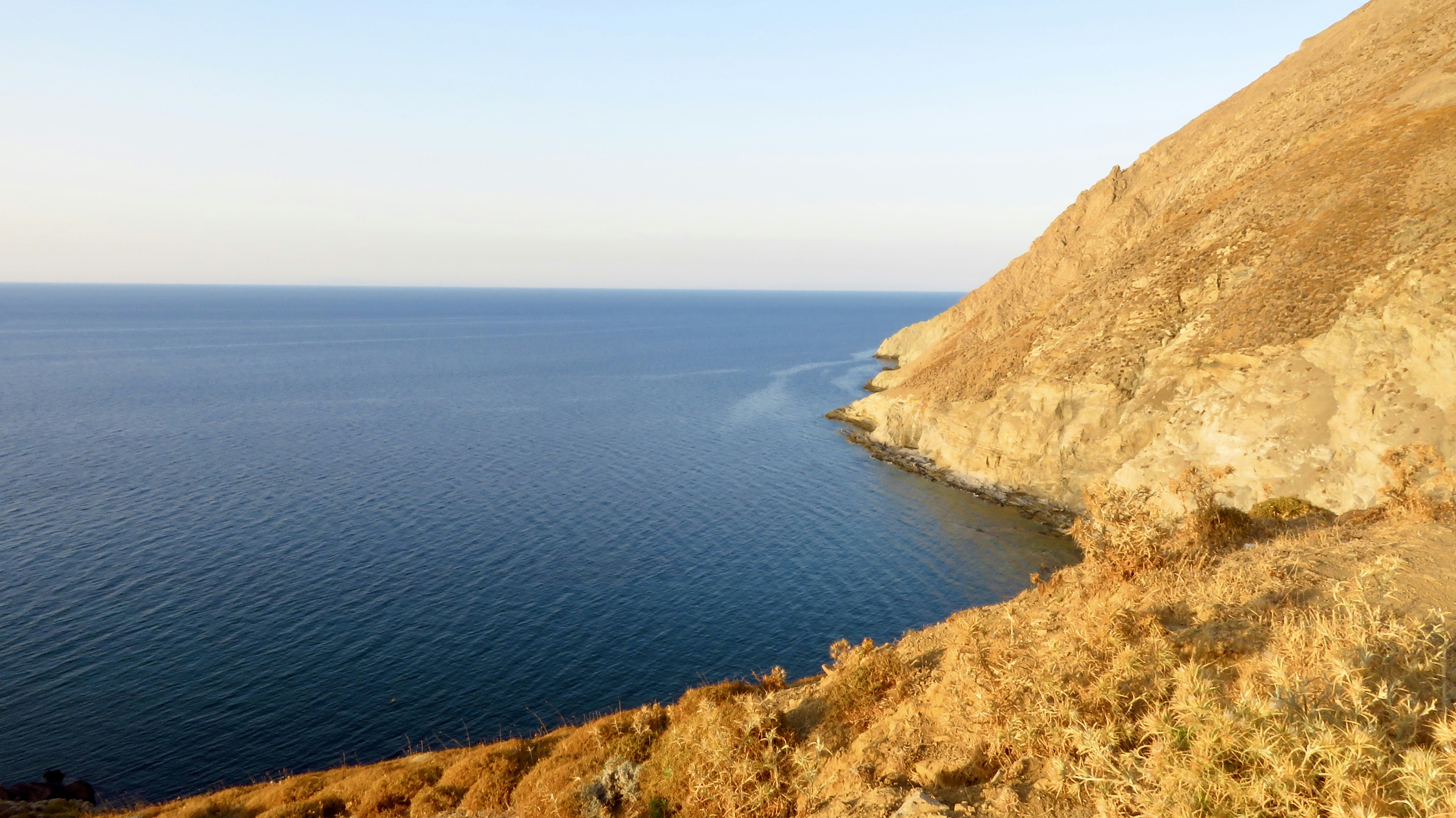 Echoes of Cliff and Sea: Golden Slope Meeting the Horizon
