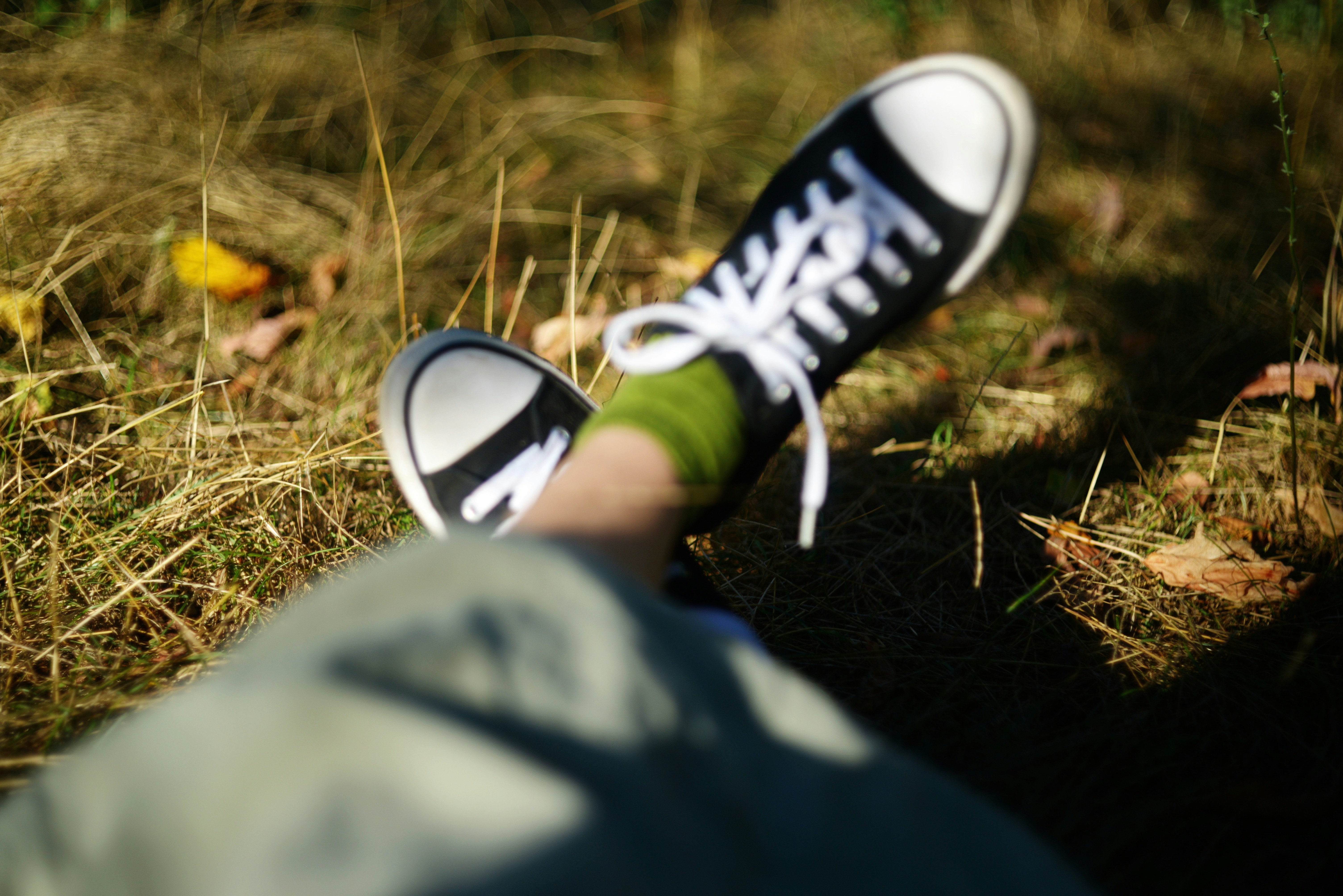 A Kickback Moment: Over-the-Top Footwear in a Grassy Scene