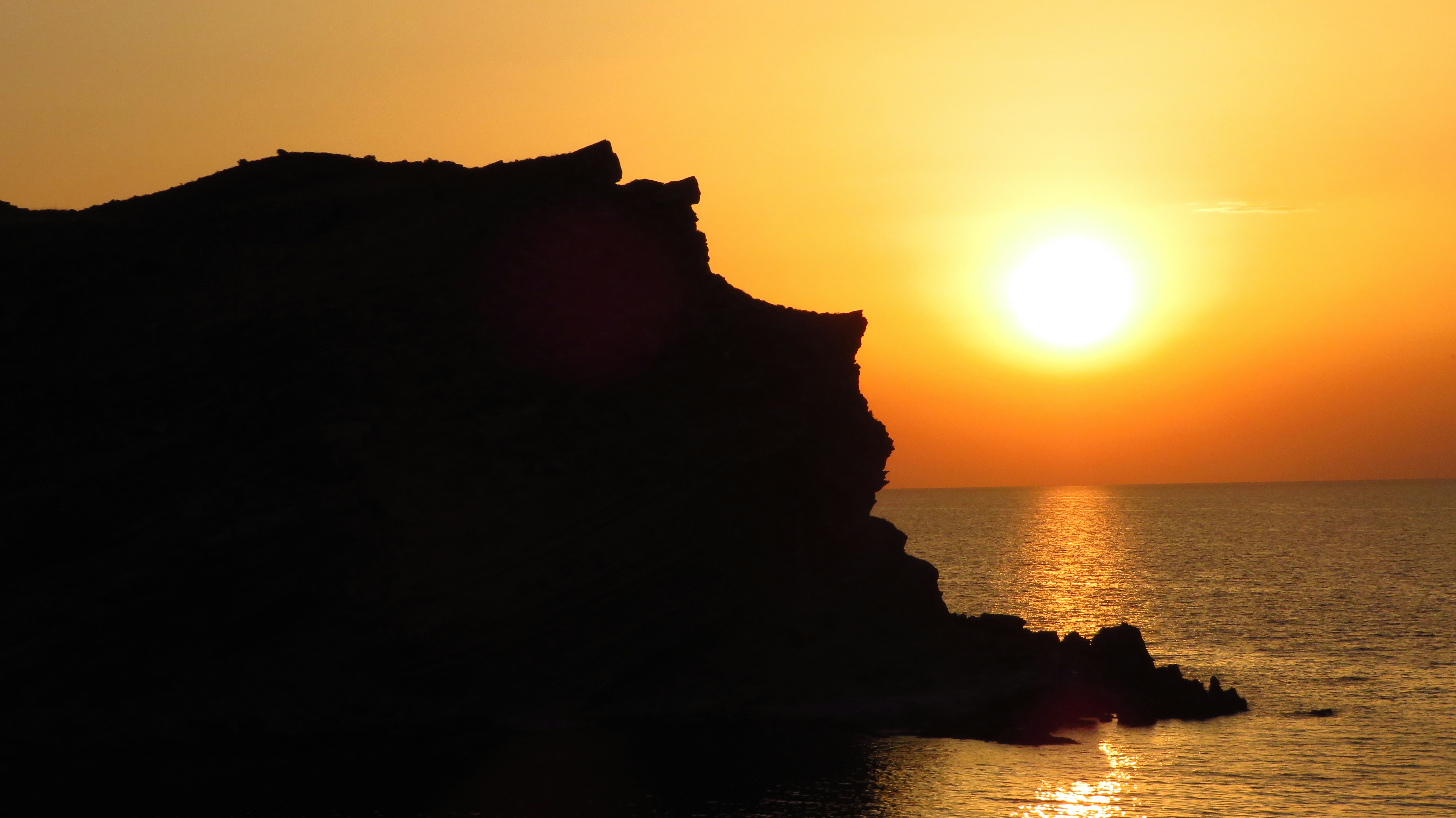 Sunlit Clifftop Silence Over the Quiet Sea